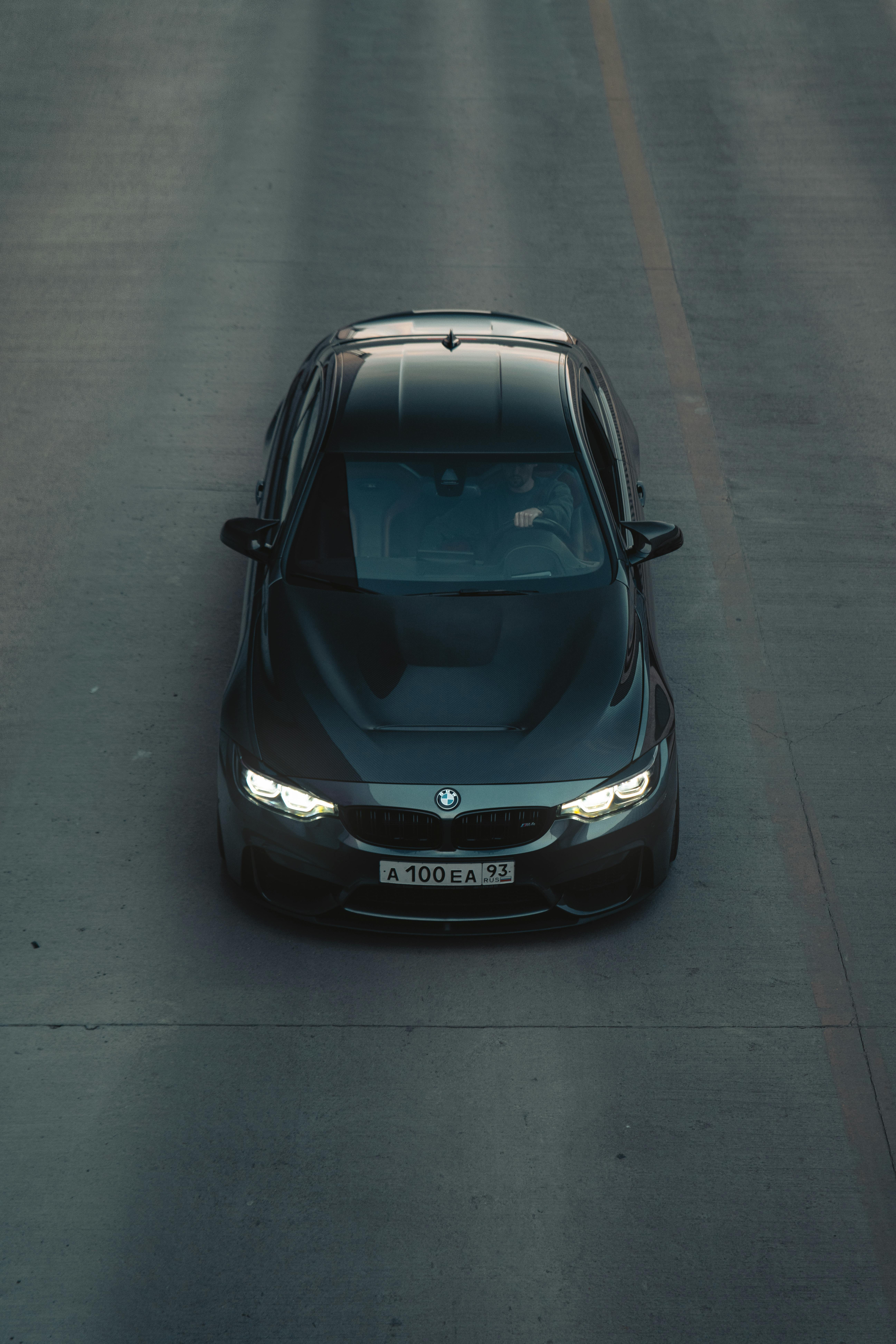 Aerial View of a Black BMW M4 on a Street · Free Stock Photo
