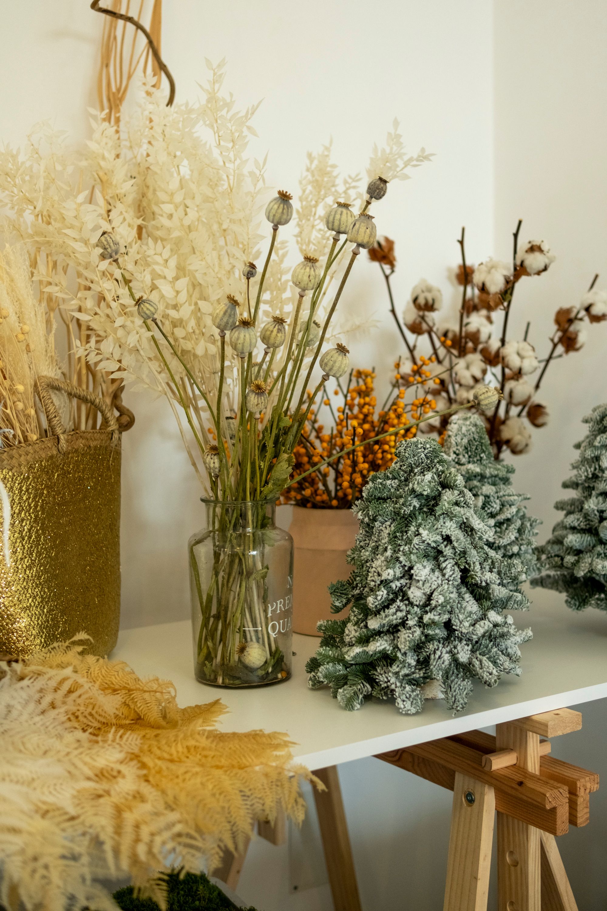 Various Decorative Twigs on a Wooden Table · Free Stock Photo