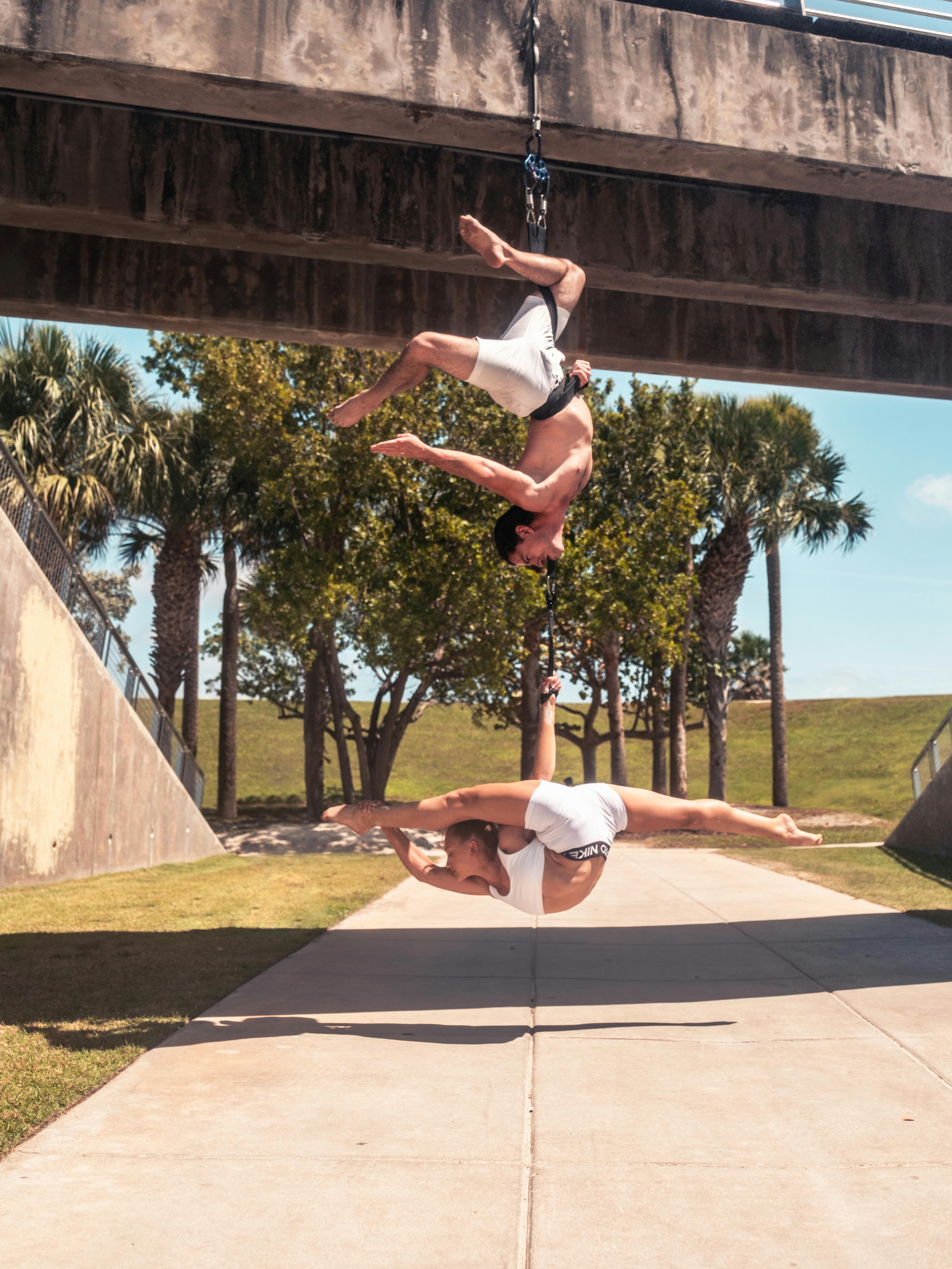 Models Hanging over Alley in Park · Free Stock Photo
