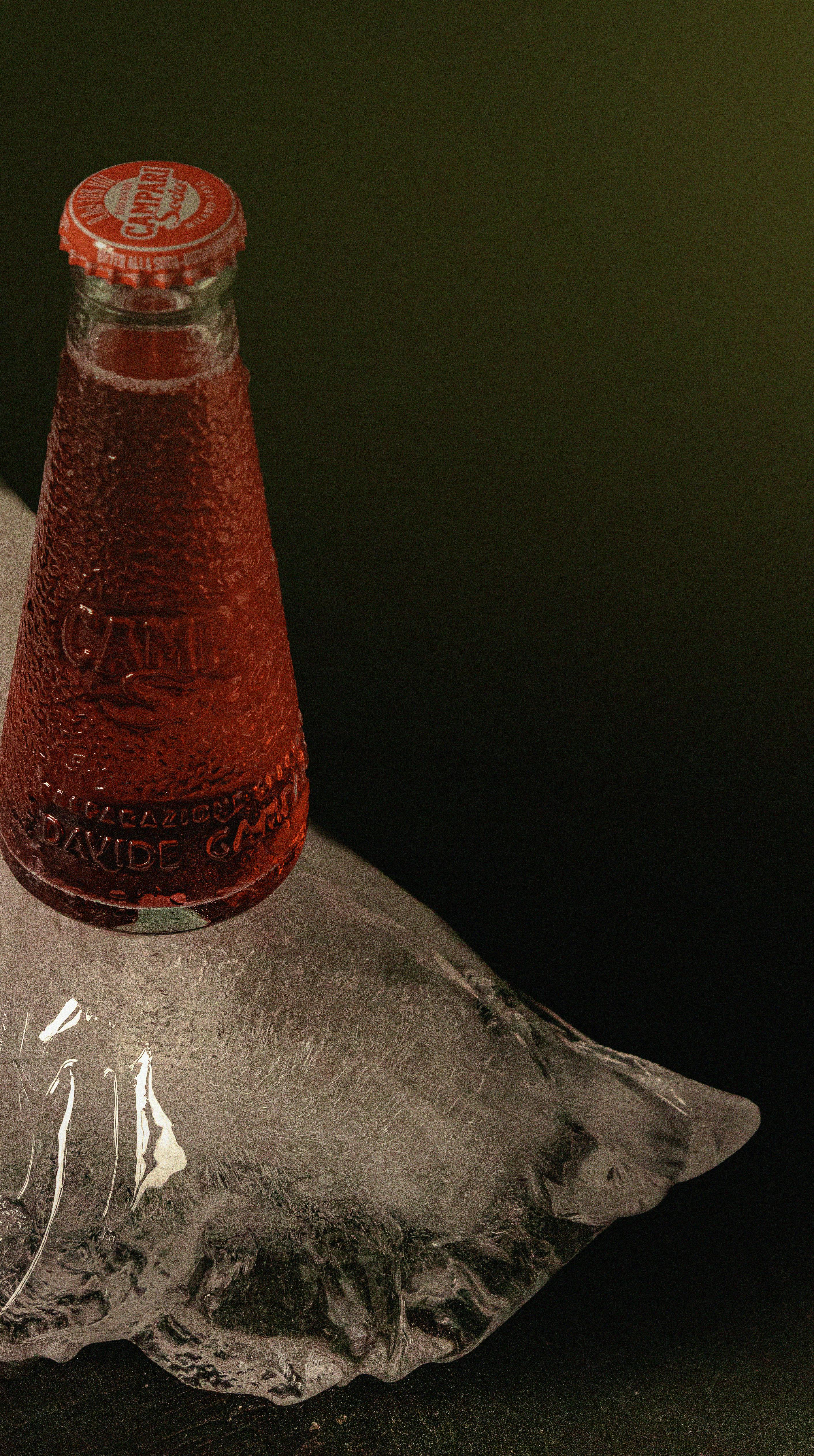 Bottle of Campari Soda on a Block of Ice · Free Stock Photo