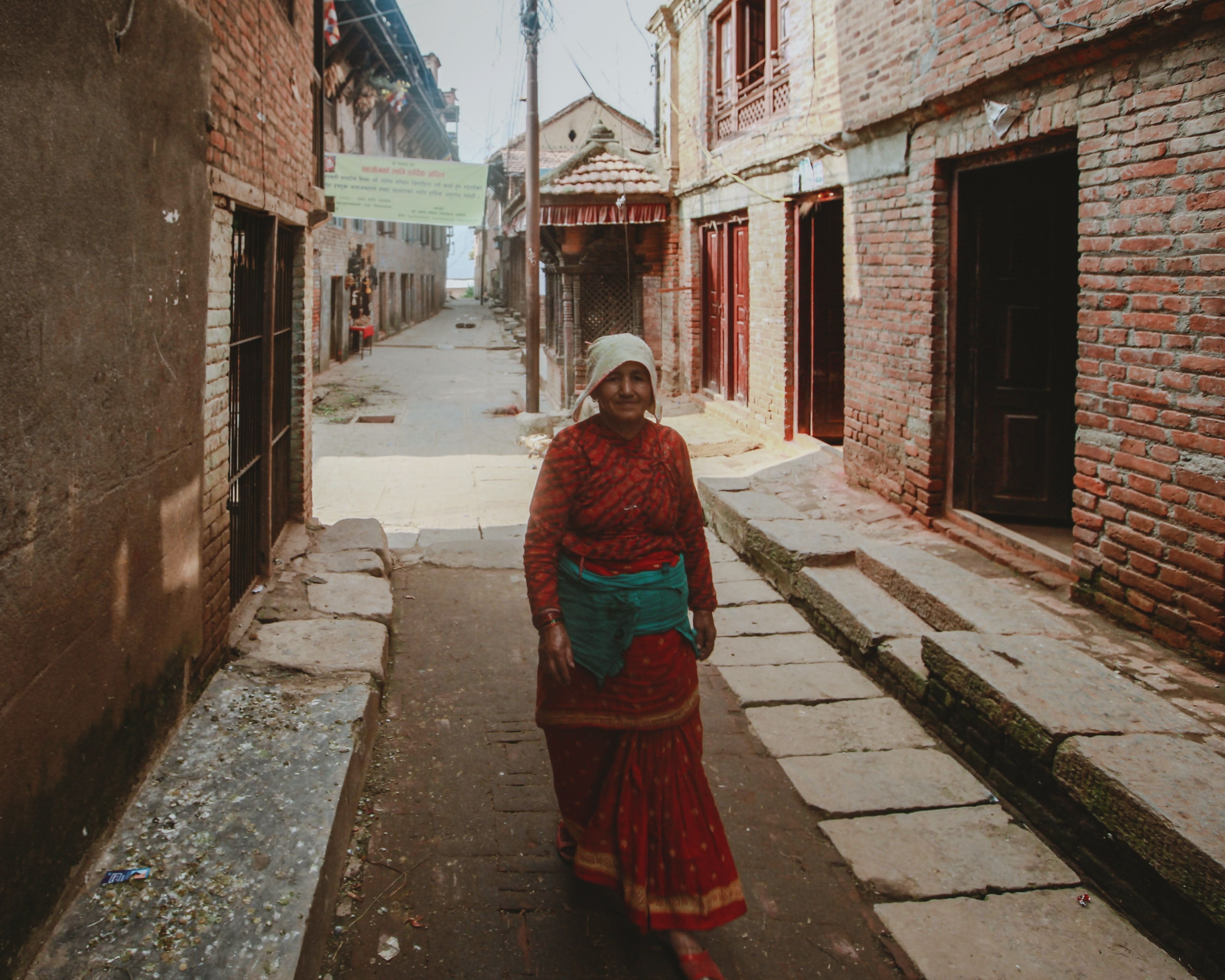 A Woman Walking in a Town · Free Stock Photo