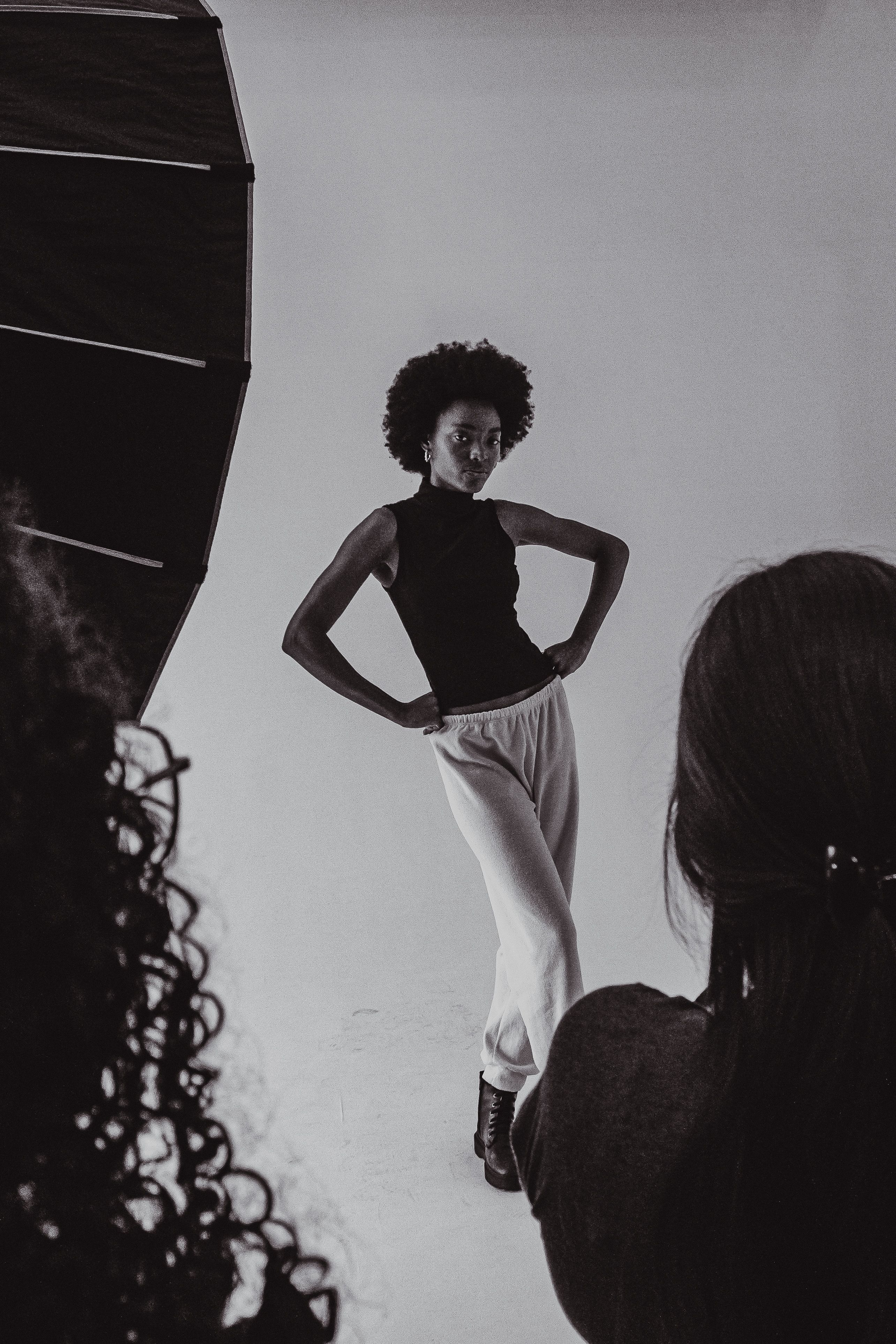 Young Woman in a Simple Outfit Posing in Studio · Free Stock Photo