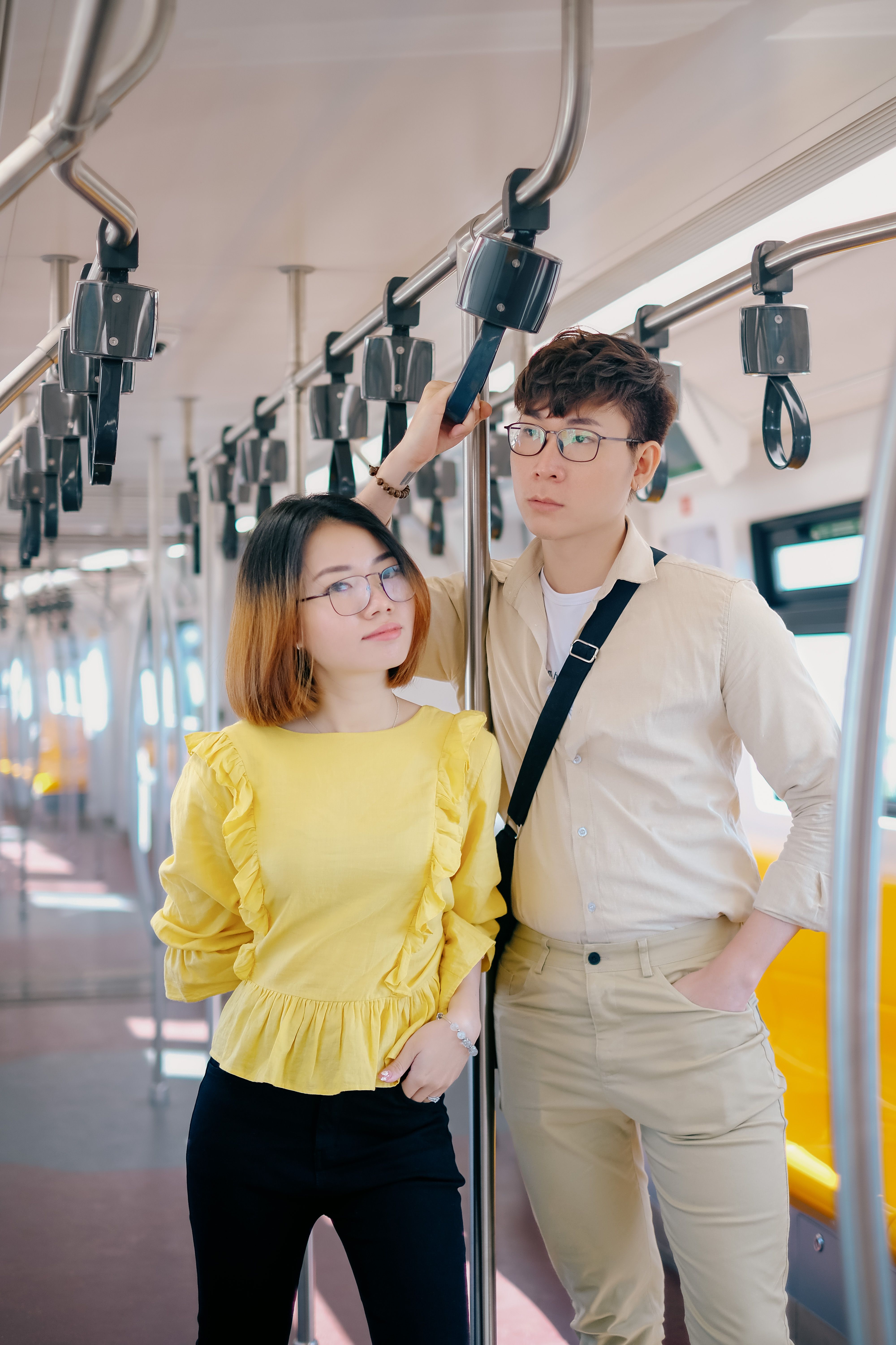 Woman and Man Standing on Metro Train · Free Stock Photo