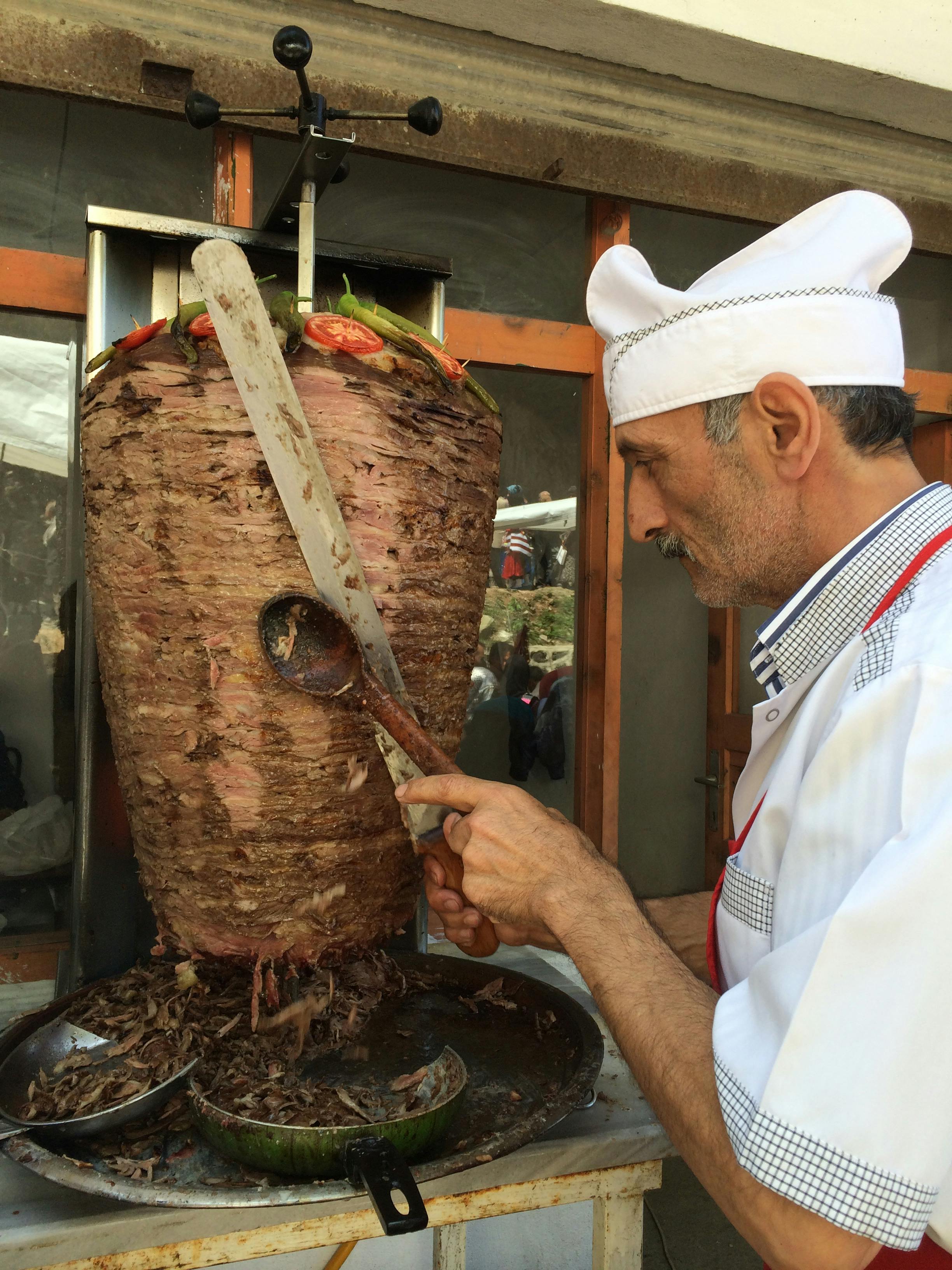 Man Cutting Meat for Kebab · Free Stock Photo