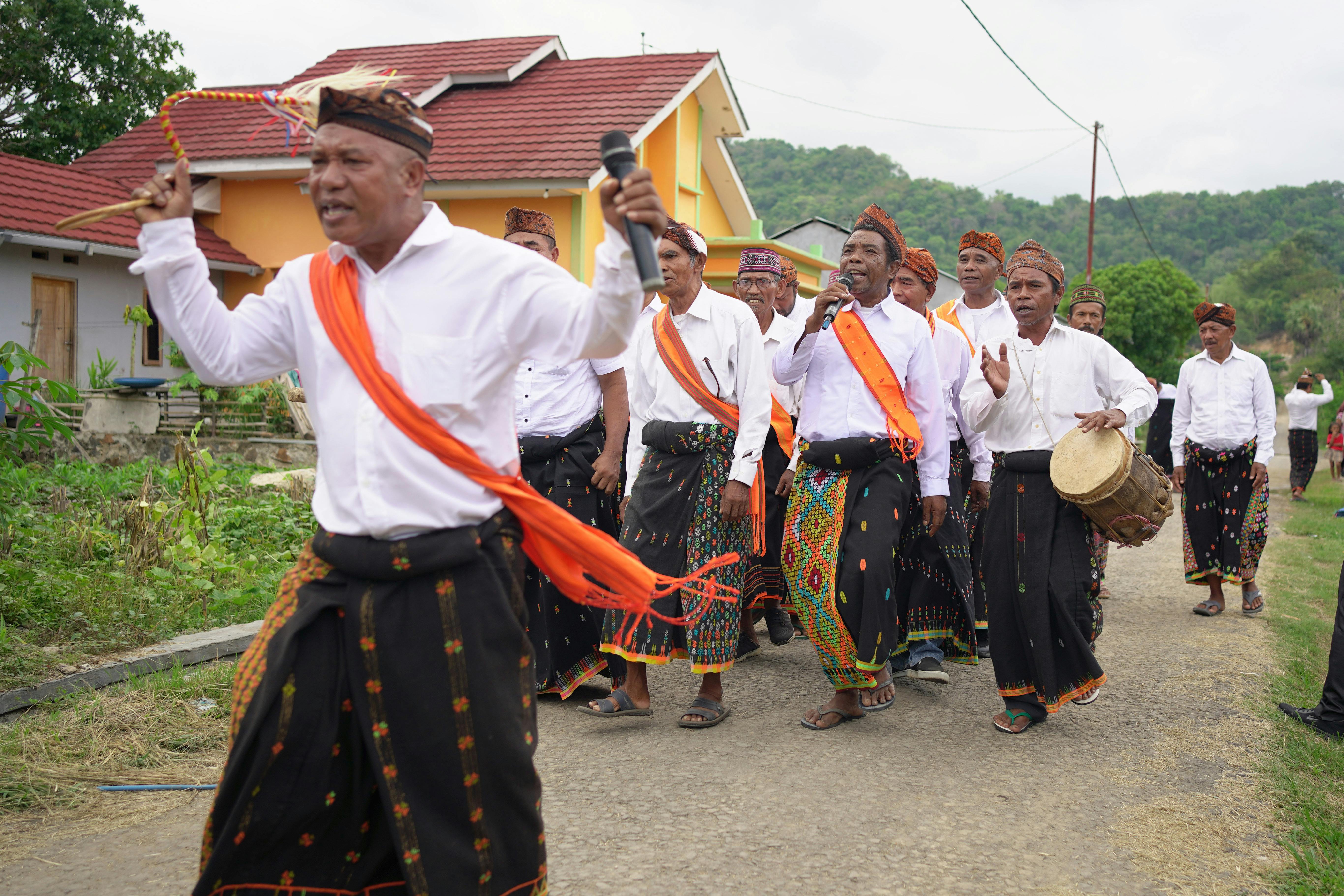 Men in Traditional Clothing Walking in Village · Free Stock Photo