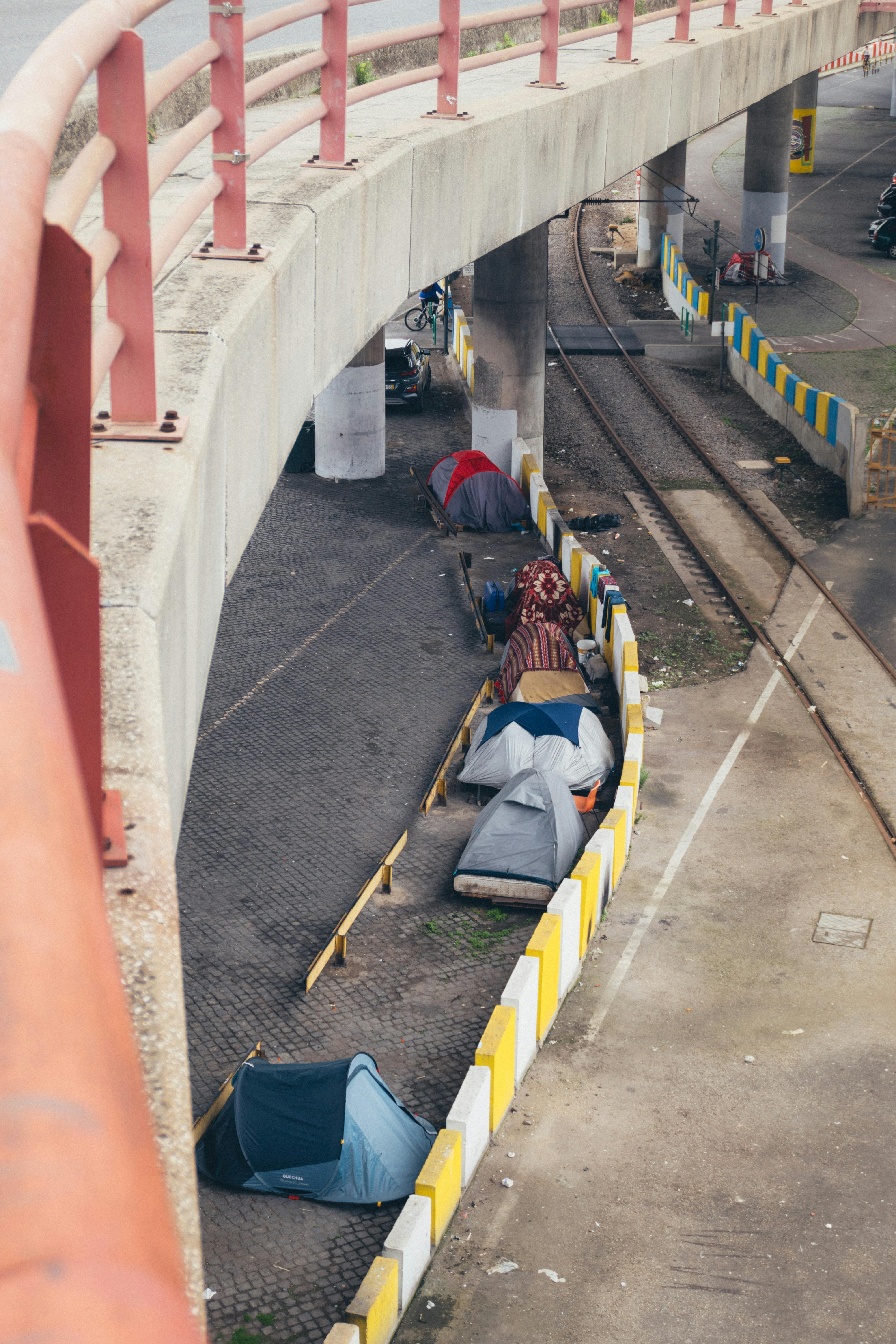 Tents on Road under Bridge · Free Stock Photo