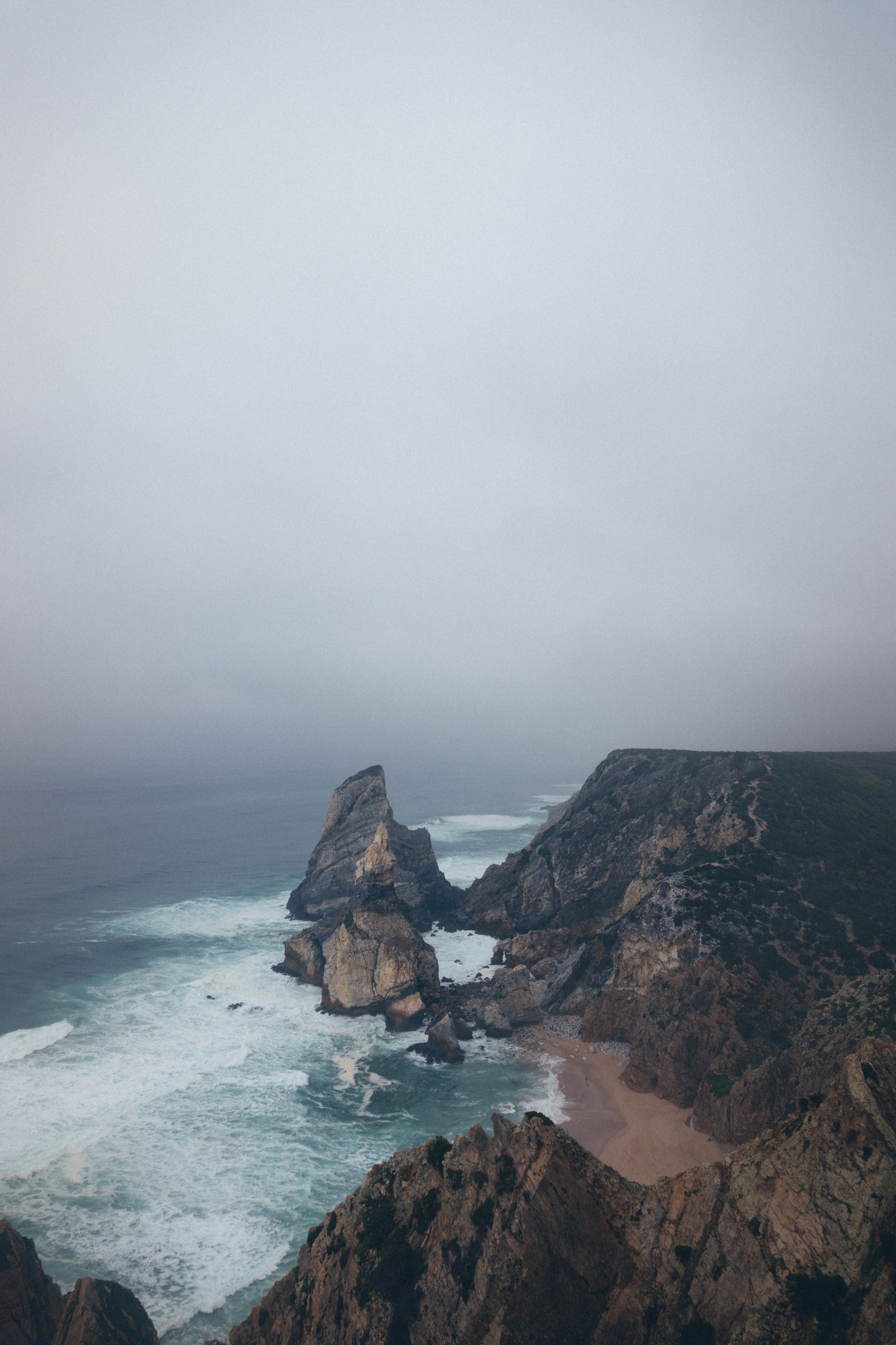 Rocky Cliffs by the Shore · Free Stock Photo