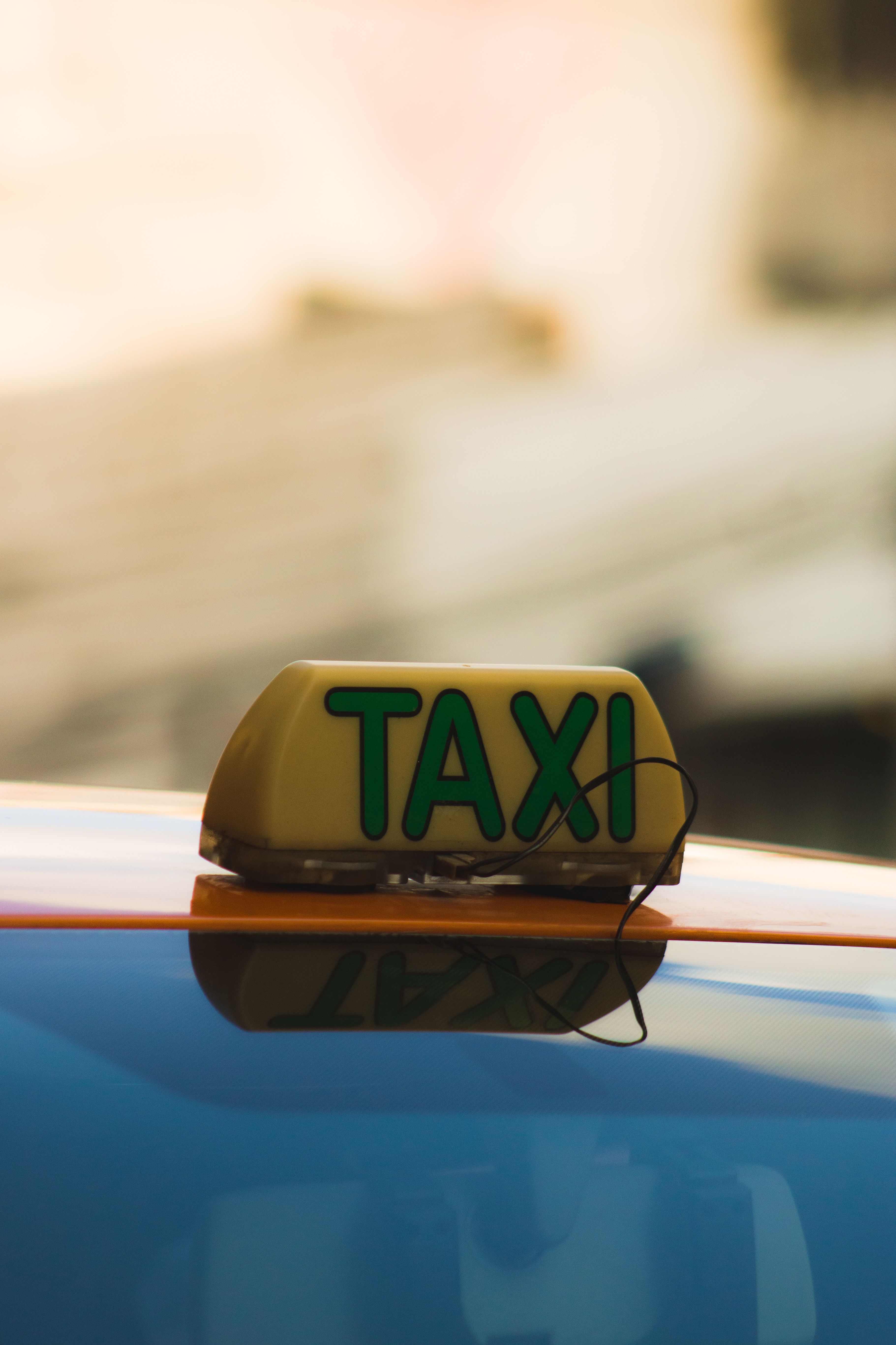 Close up of a Taxi Sign on a Car · Free Stock Photo