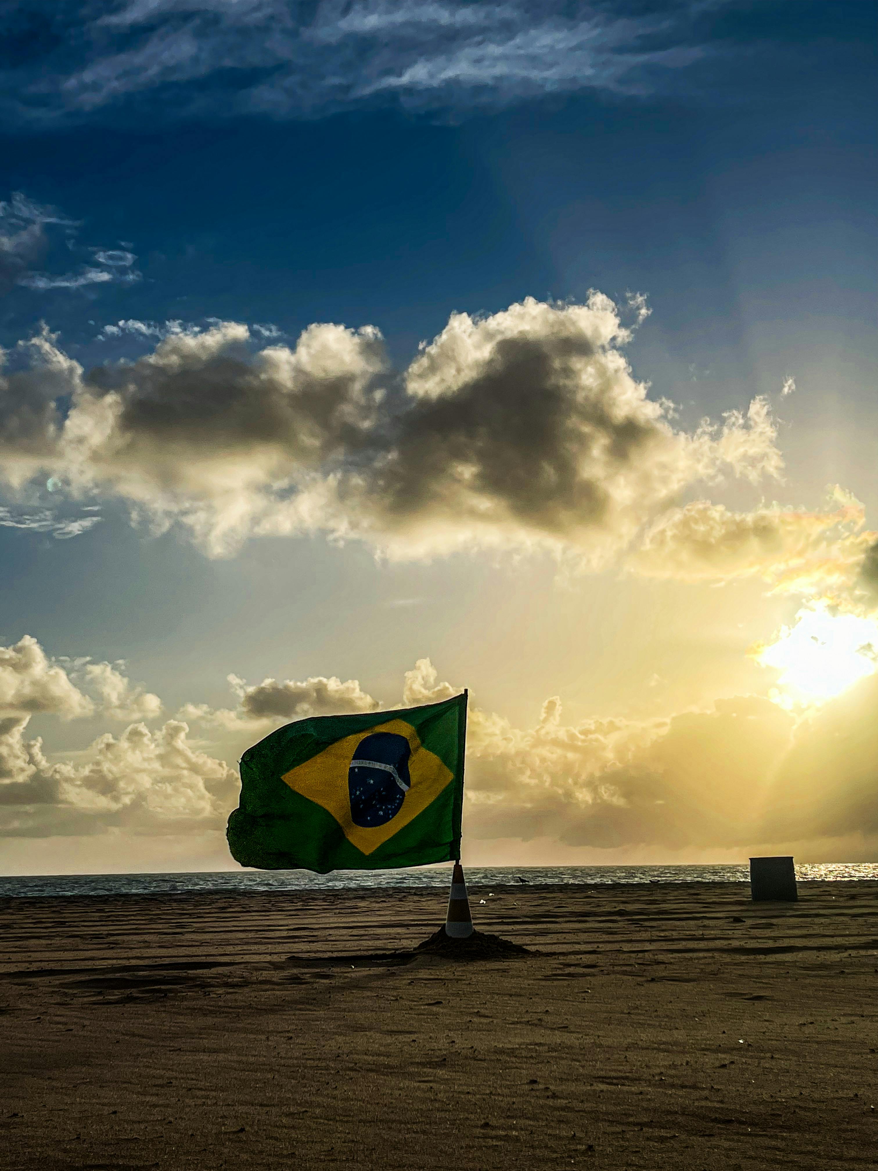 Flag of Brazil on Wind in Seaside · Free Stock Photo