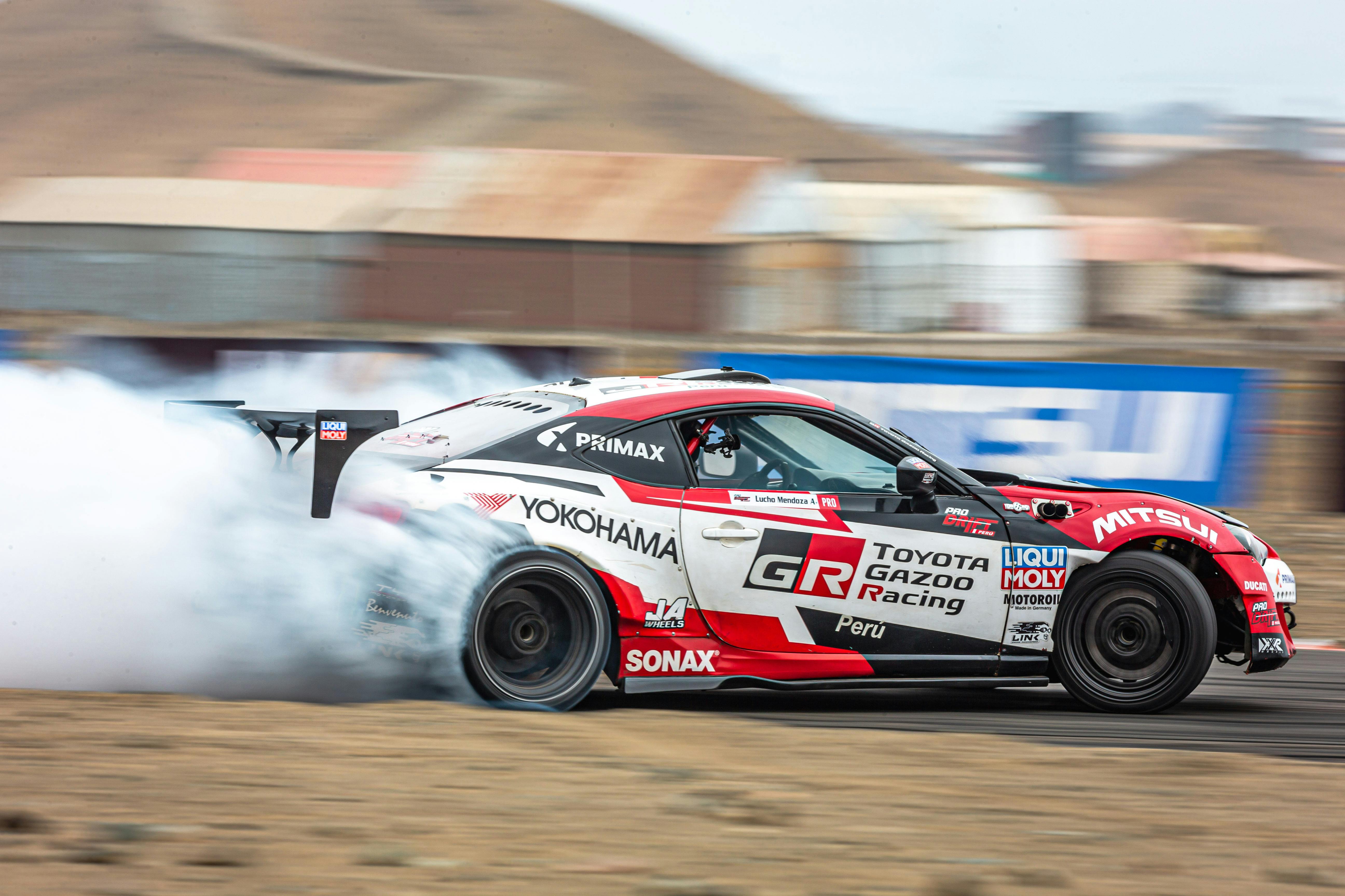 Smoke behind Sports Car during Competition · Free Stock Photo