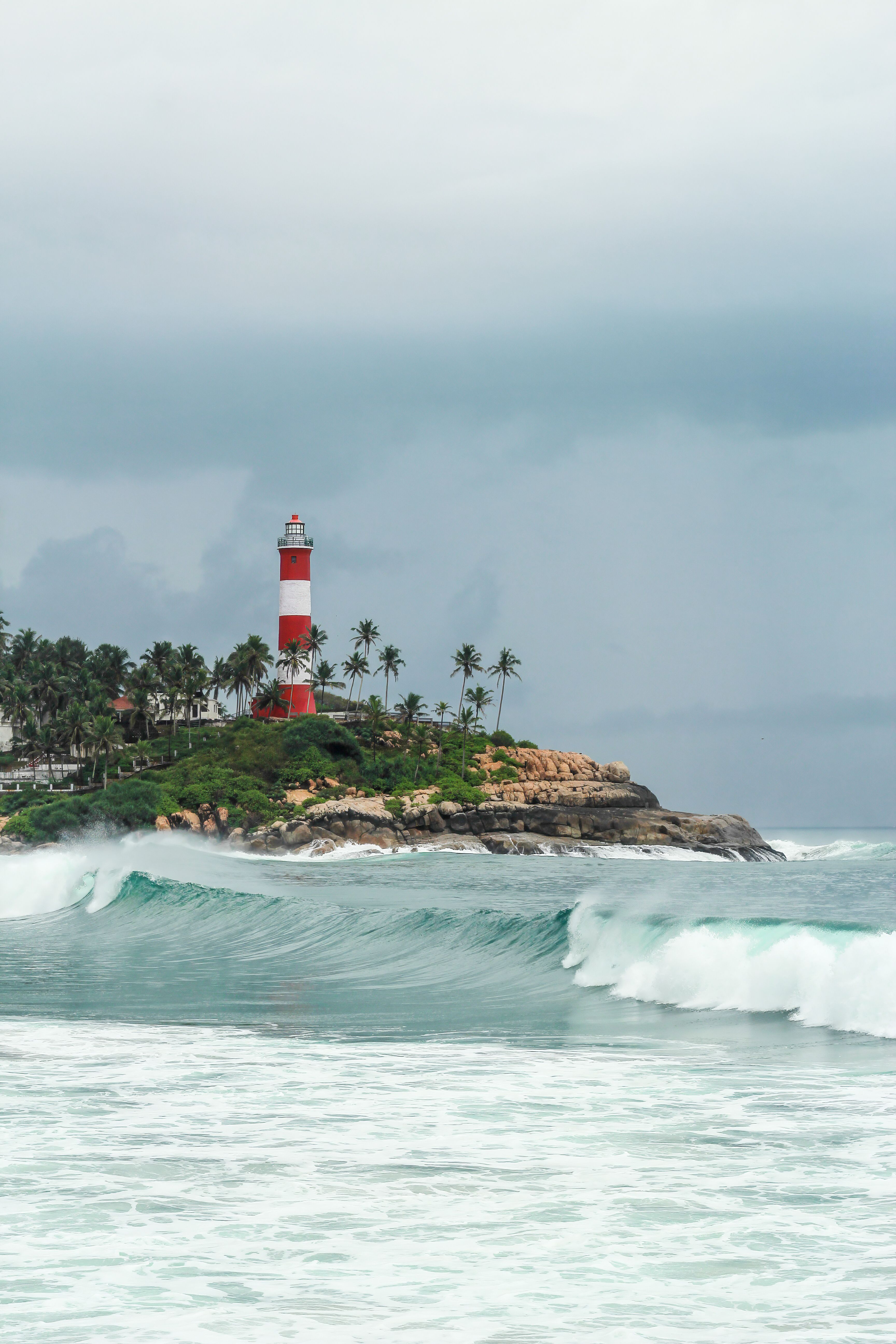 Scenic Lighthouse on Tropical Island Shore · Free Stock Photo