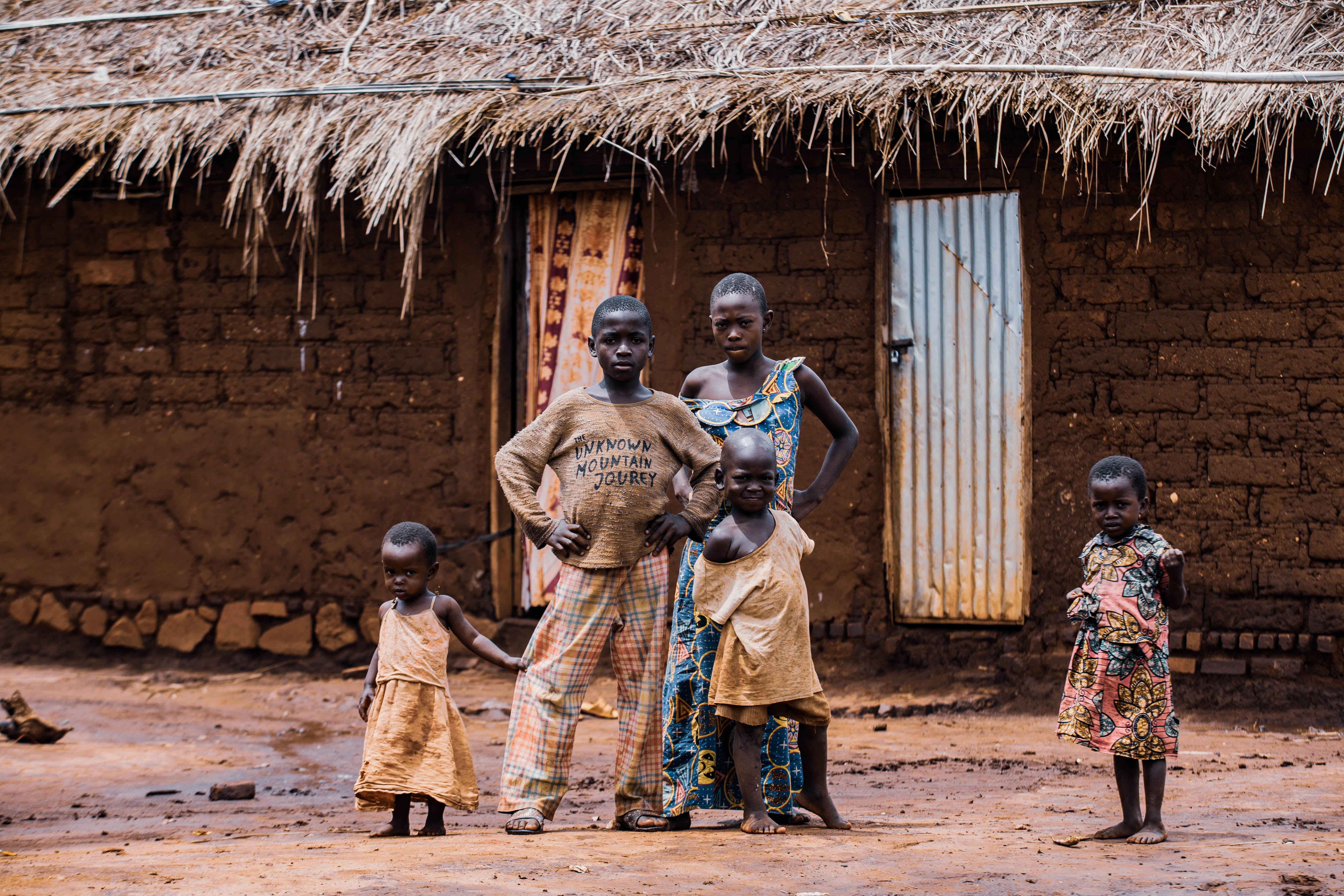 Siblings Standing Together in Village · Free Stock Photo