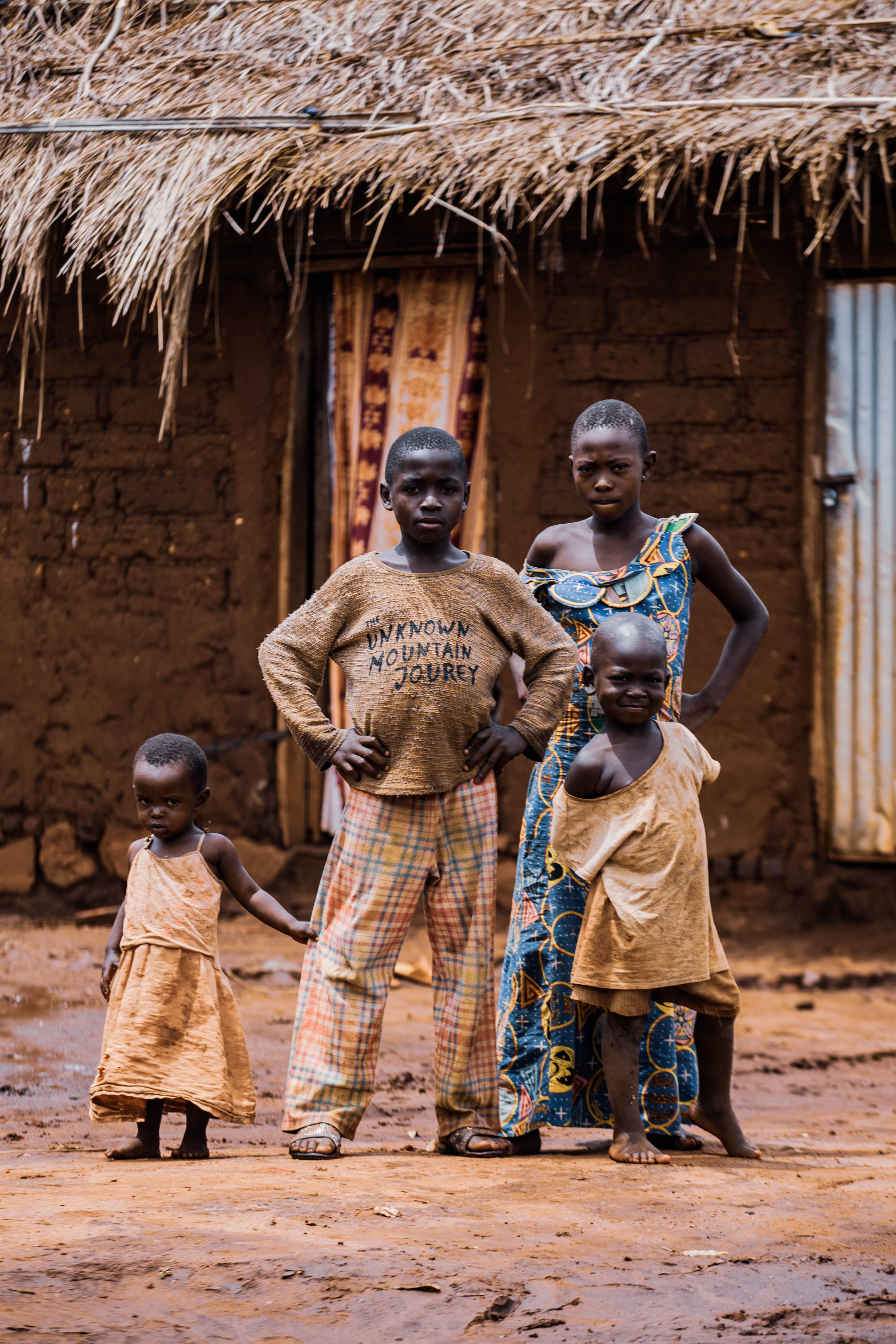 Siblings Standing Together in Village · Free Stock Photo
