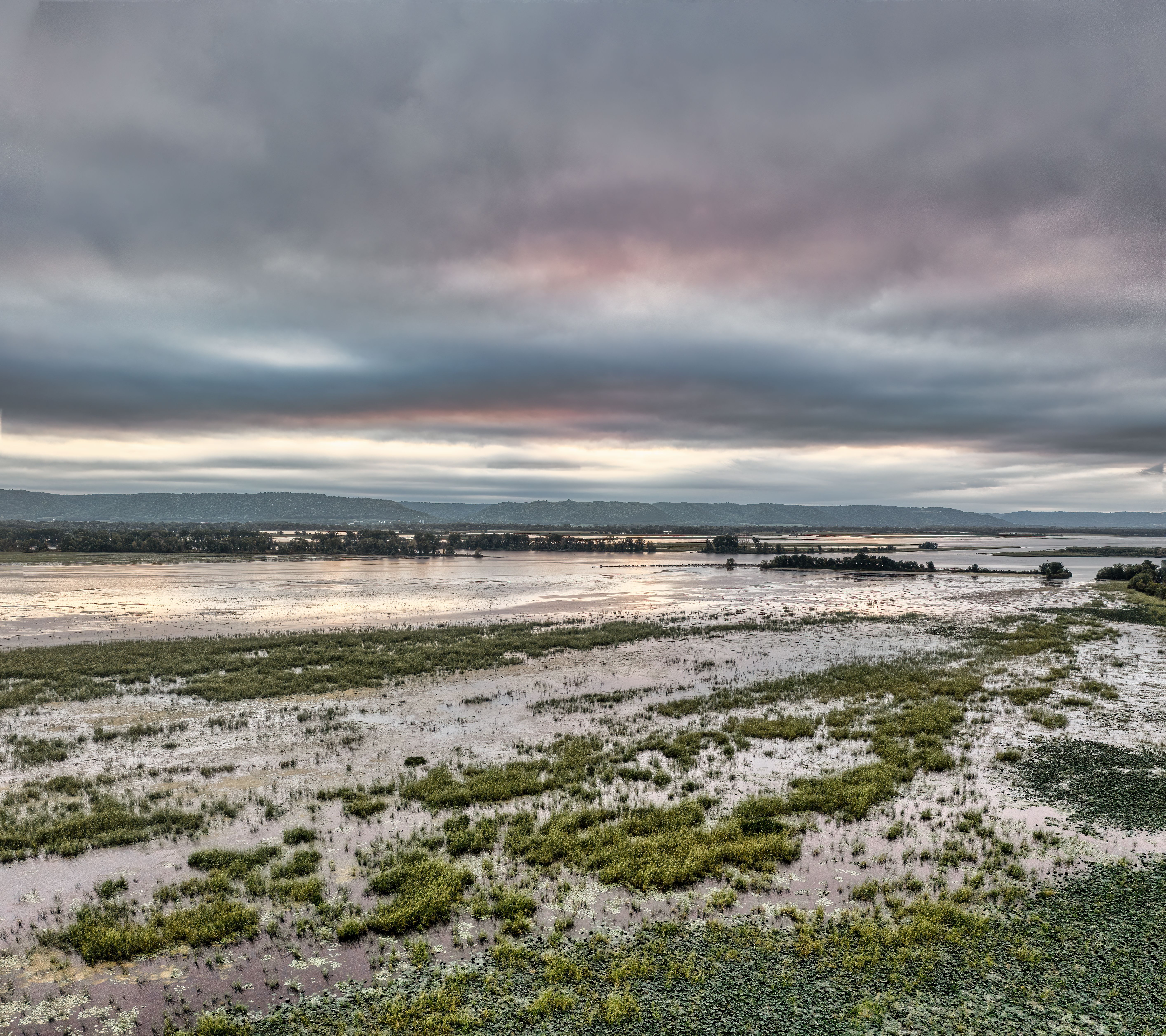 View of a Wetland under a Cloudy Sunset Sky · Free Stock Photo