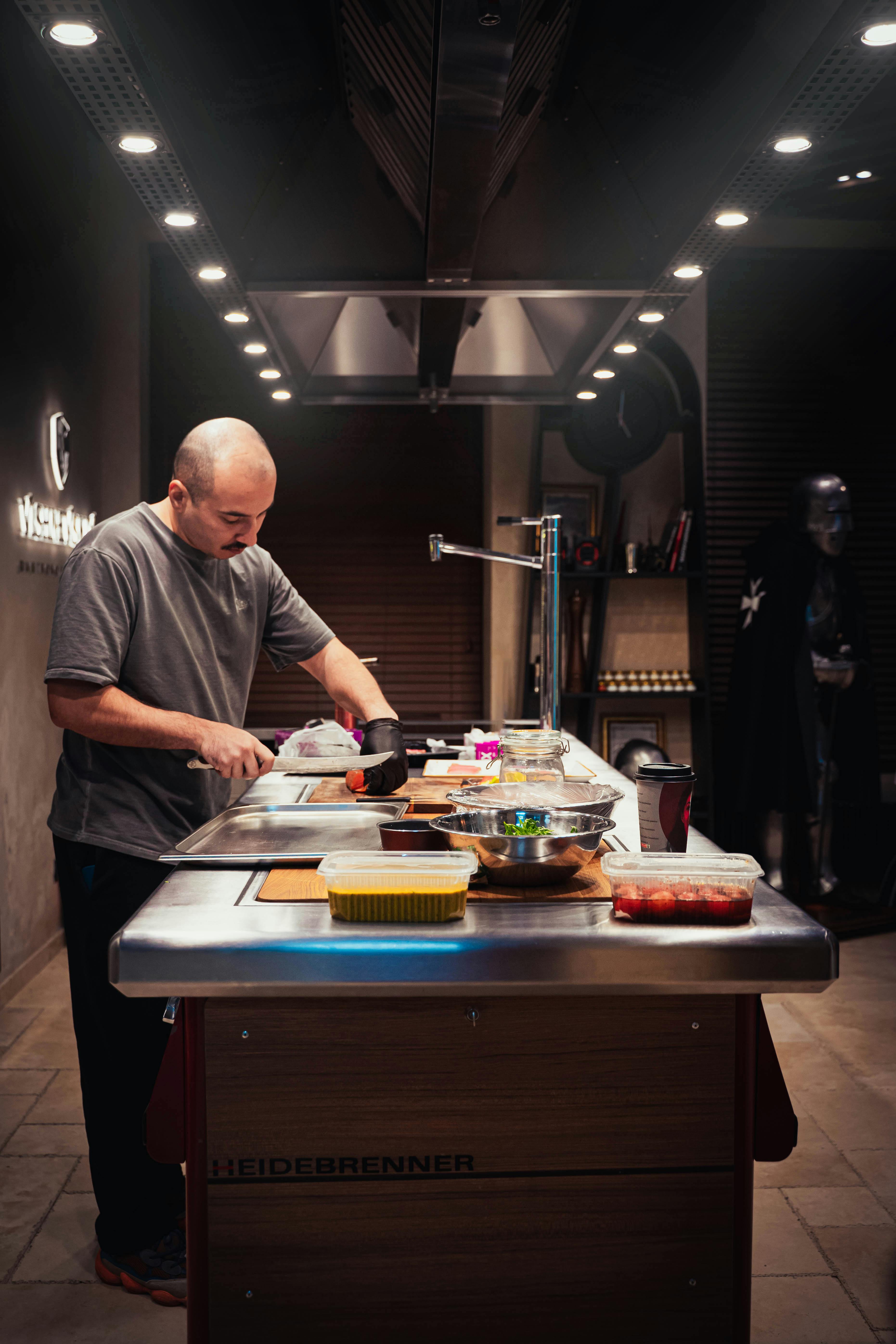 Photo of a Man Cooking in a Luxury Interior · Free Stock Photo