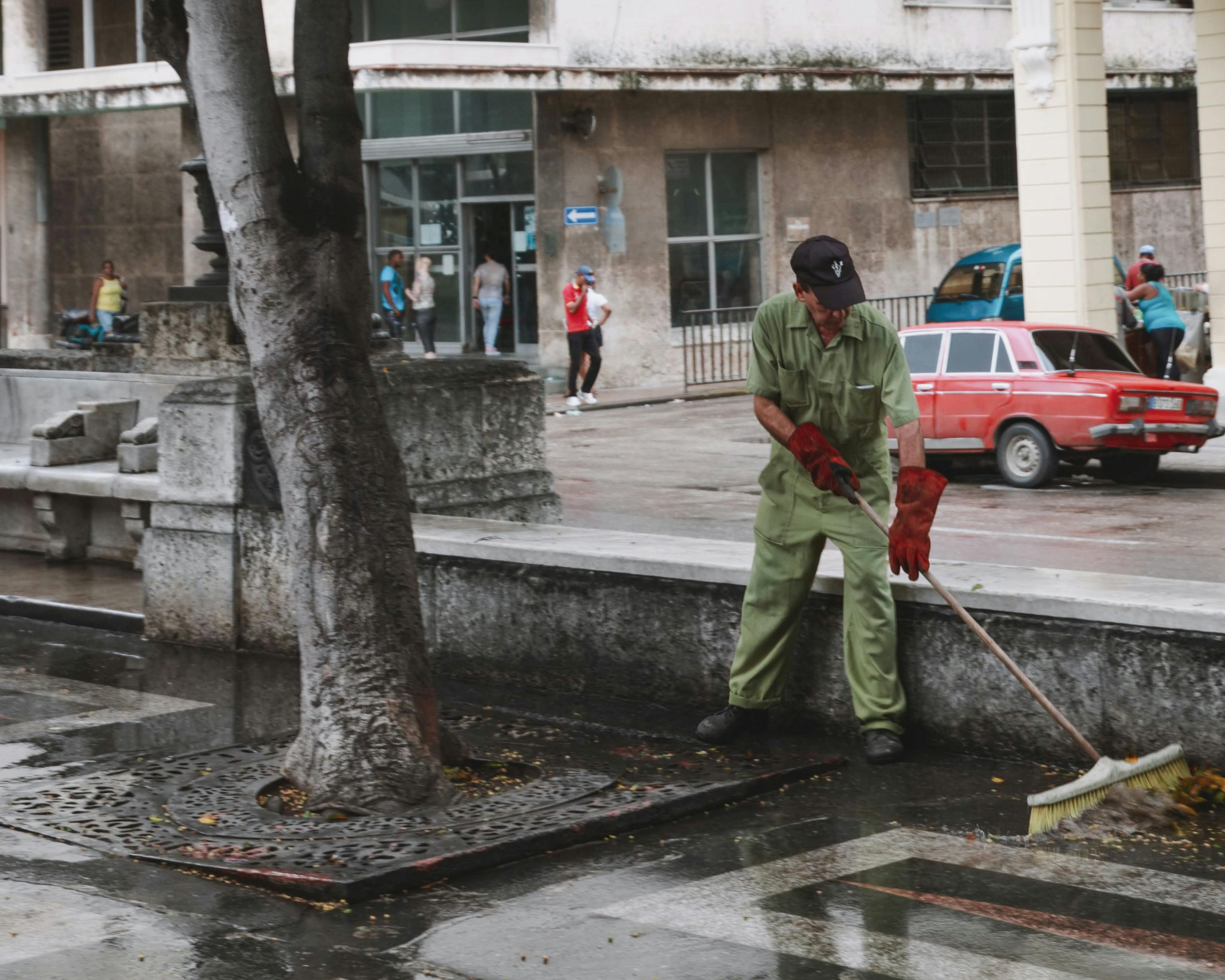 Man Sweeping the Street · Free Stock Photo