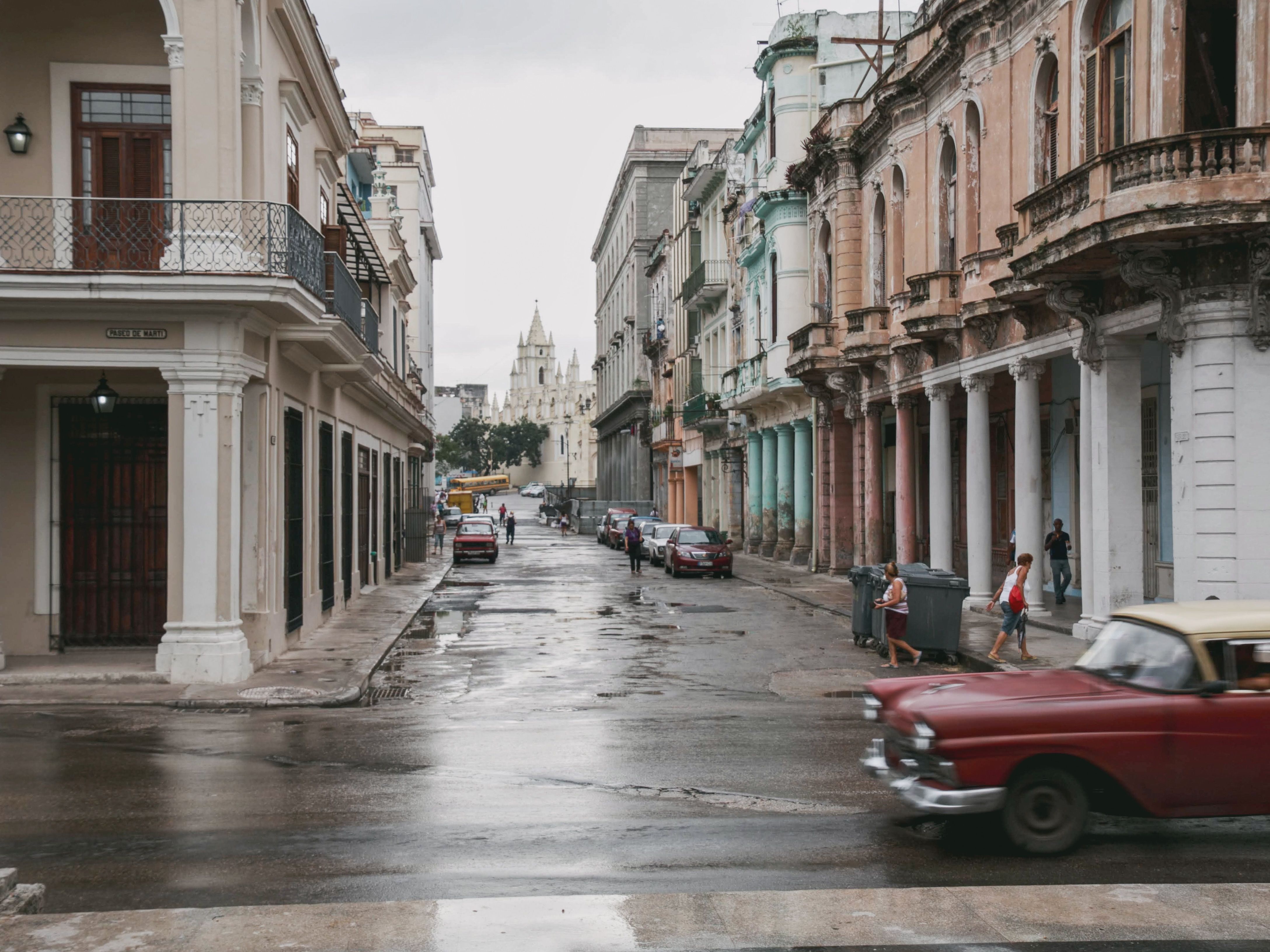 Alley with Colonial Buildings and Vintage Cars in a Cuban City · Free ...