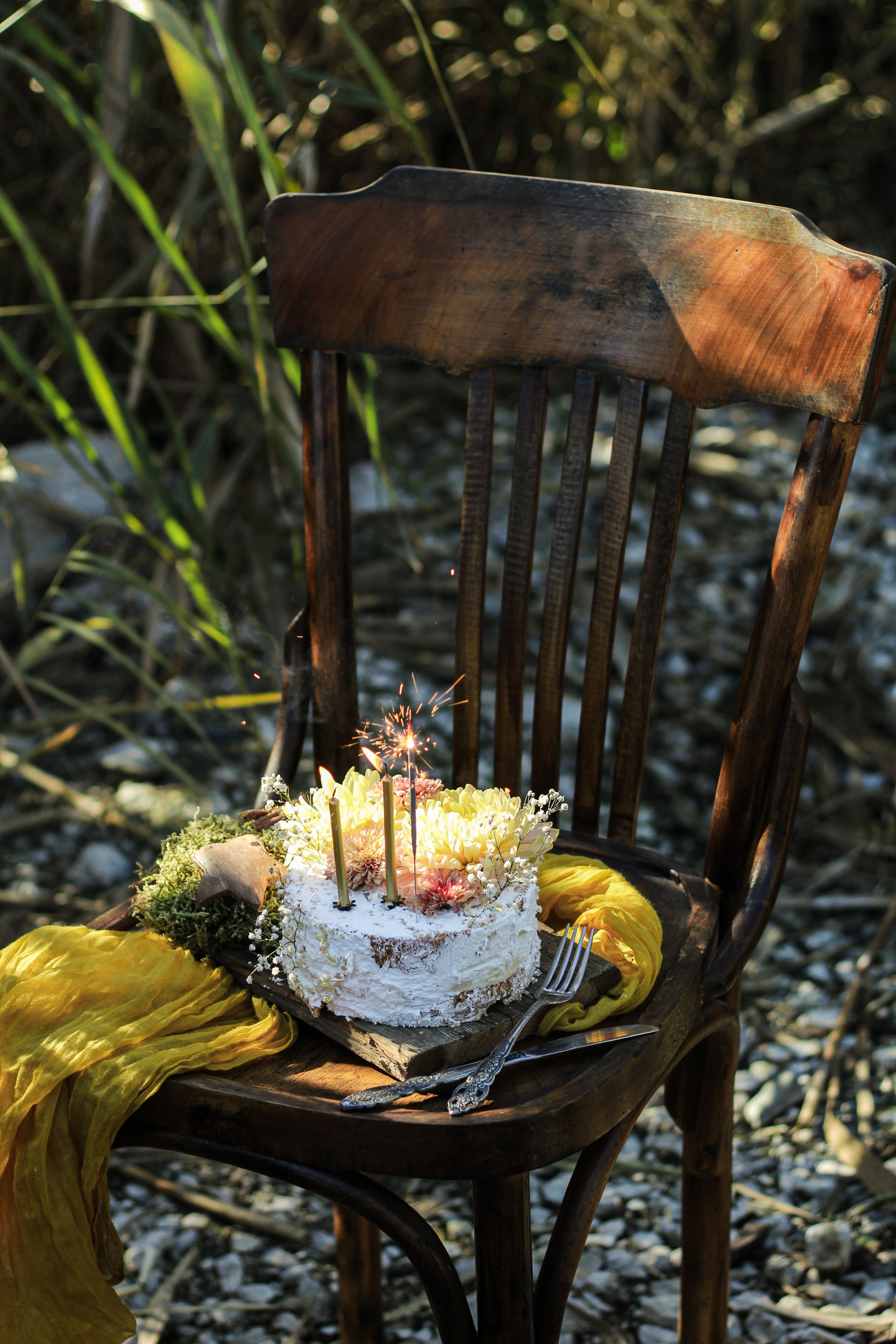 Candles on Cake on Chair · Free Stock Photo