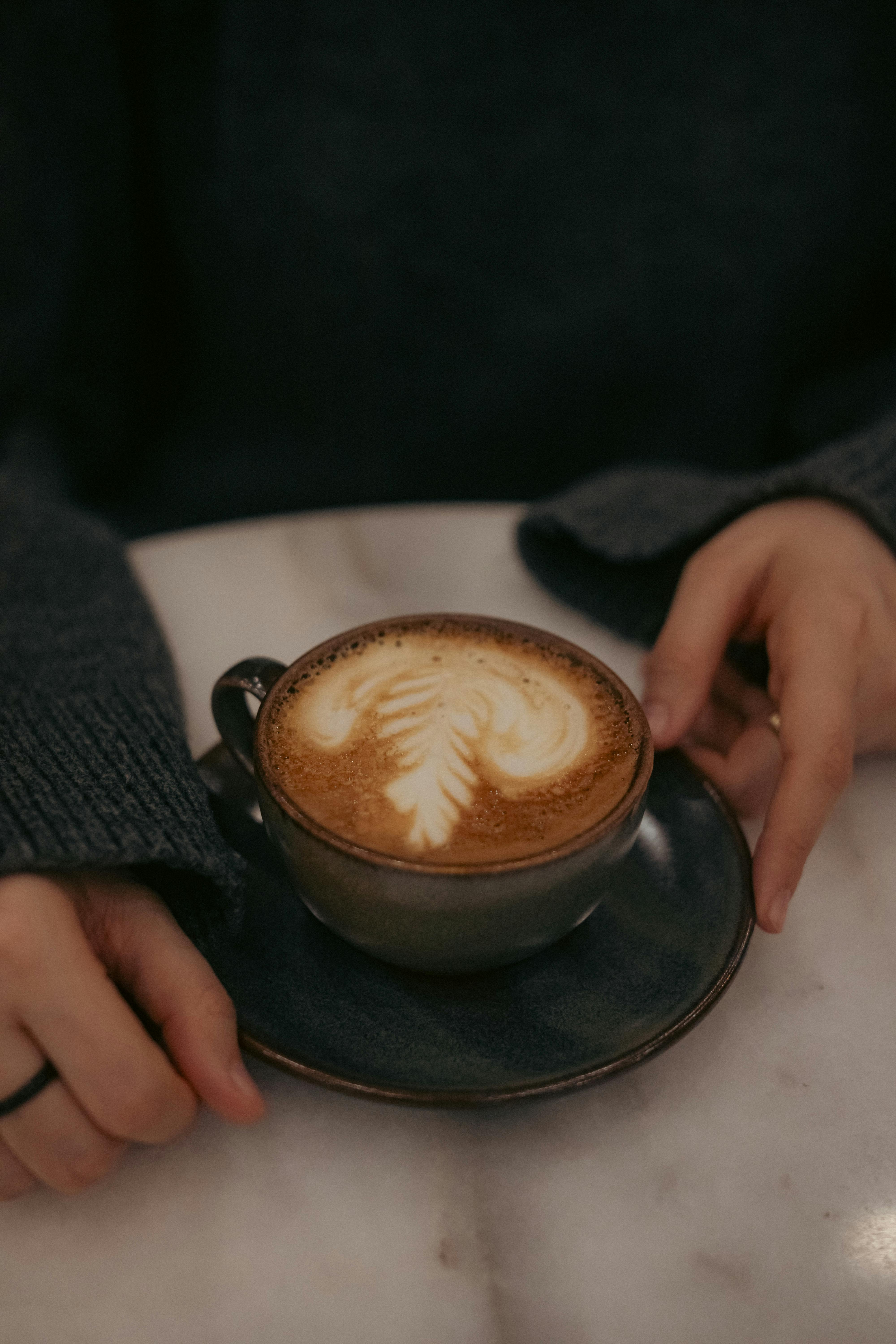 Woman Hands over Coffee Cup on Plate · Free Stock Photo