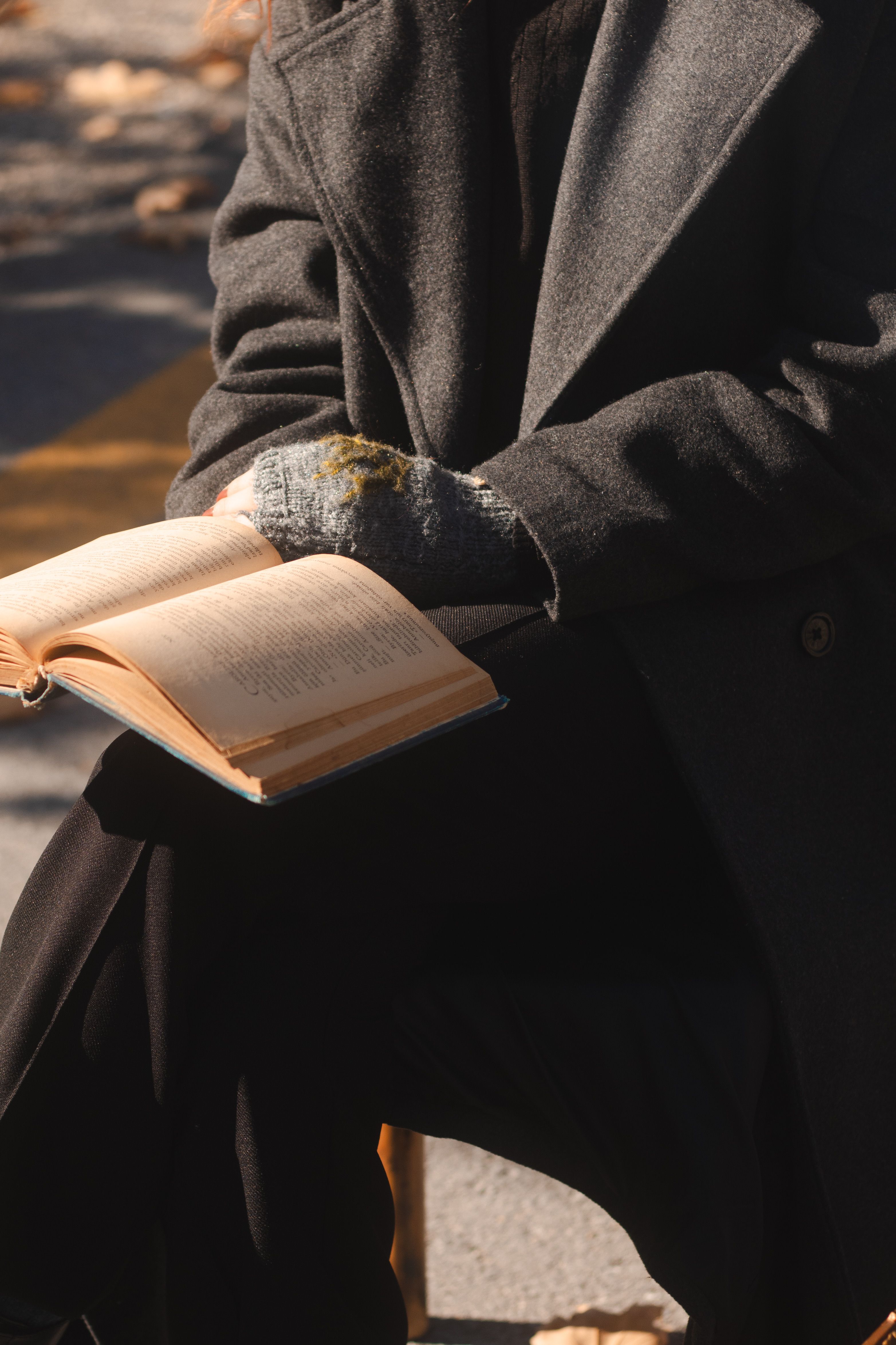 Back View of a Woman Reading a Book · Free Stock Photo