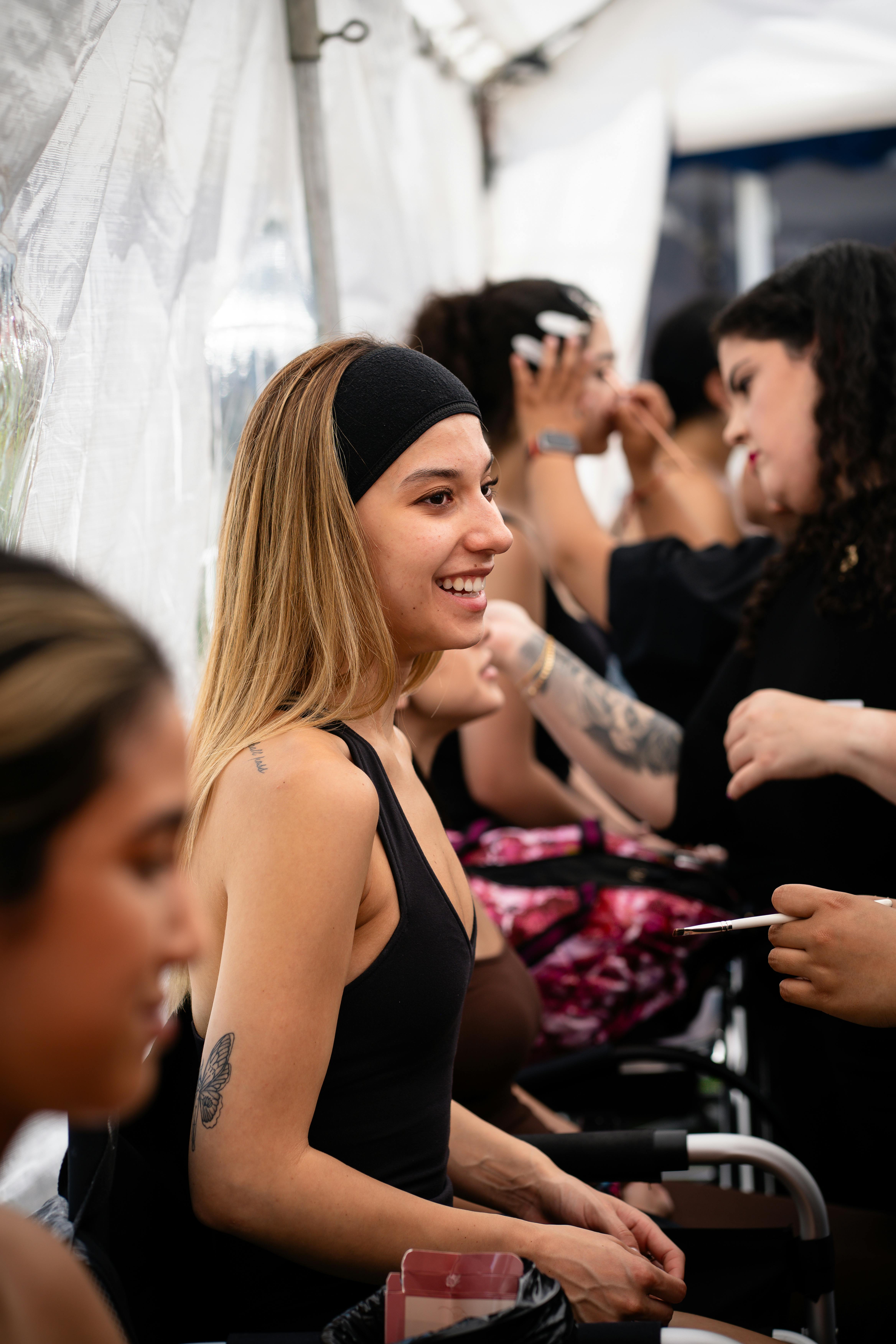 Women Getting Their Makeup Done in a Tent before a Show · Free Stock Photo