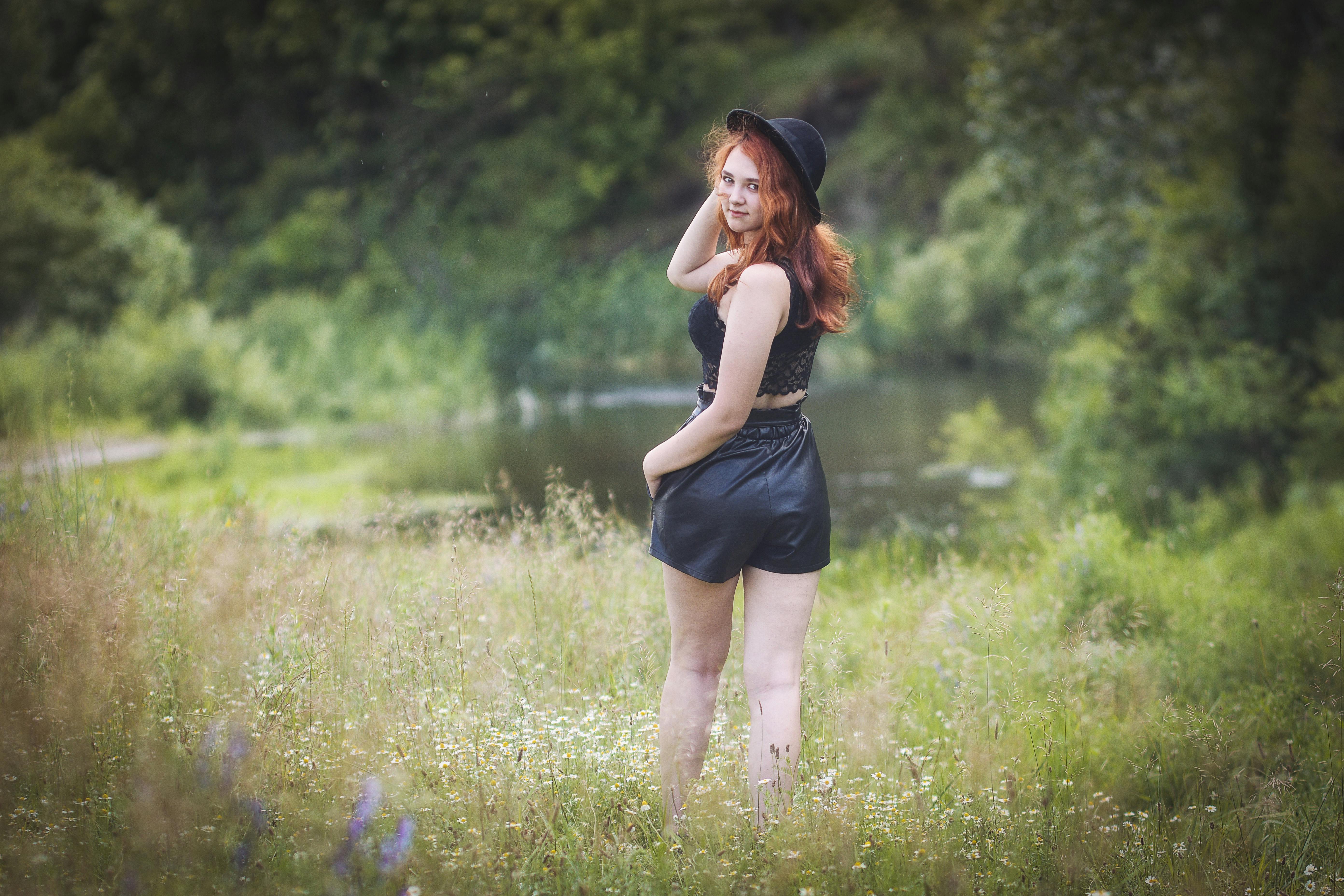 Vignette Photograph of a Redhead Girl in Meadow · Free Stock Photo
