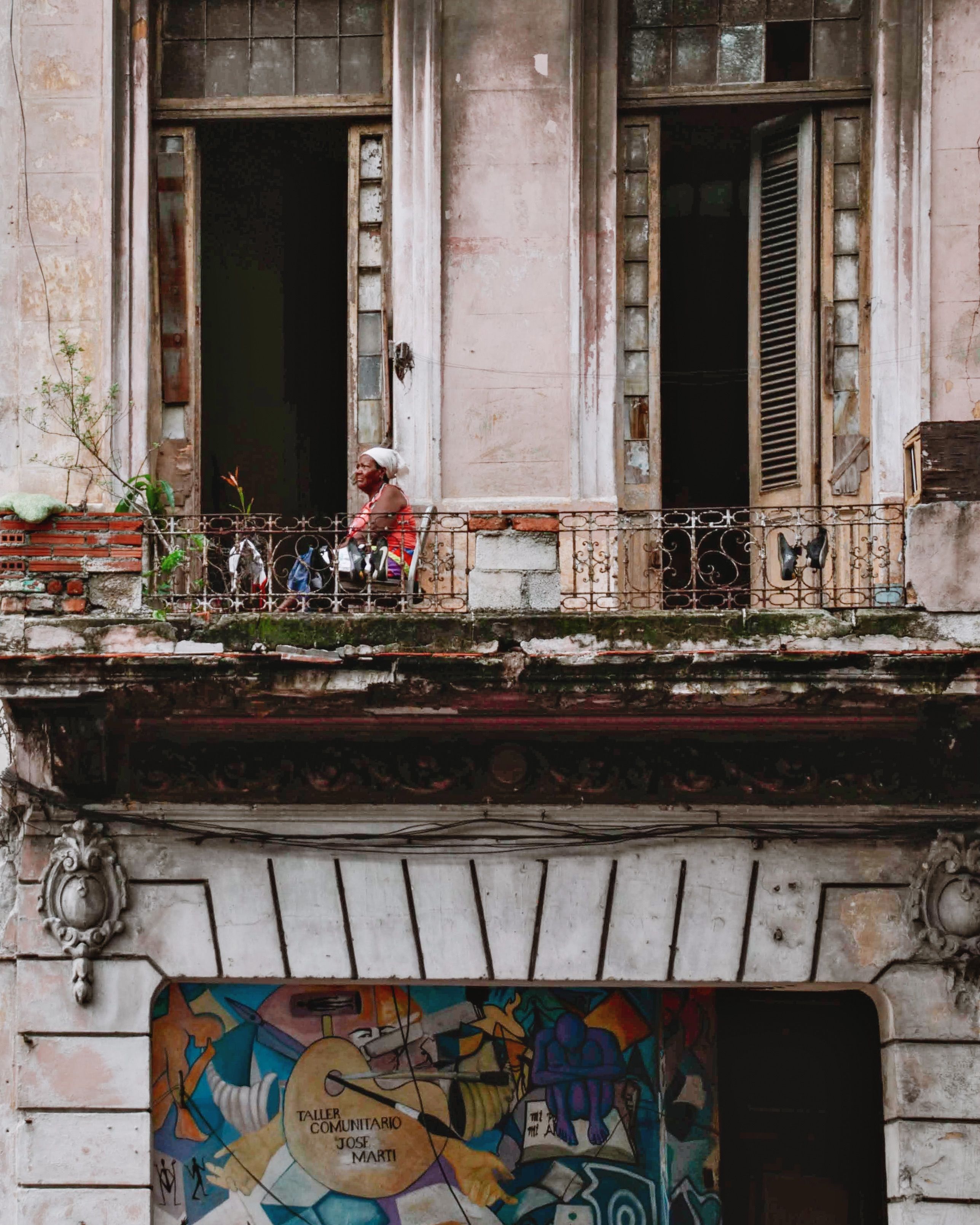 A Person Sitting on a Balcony · Free Stock Photo