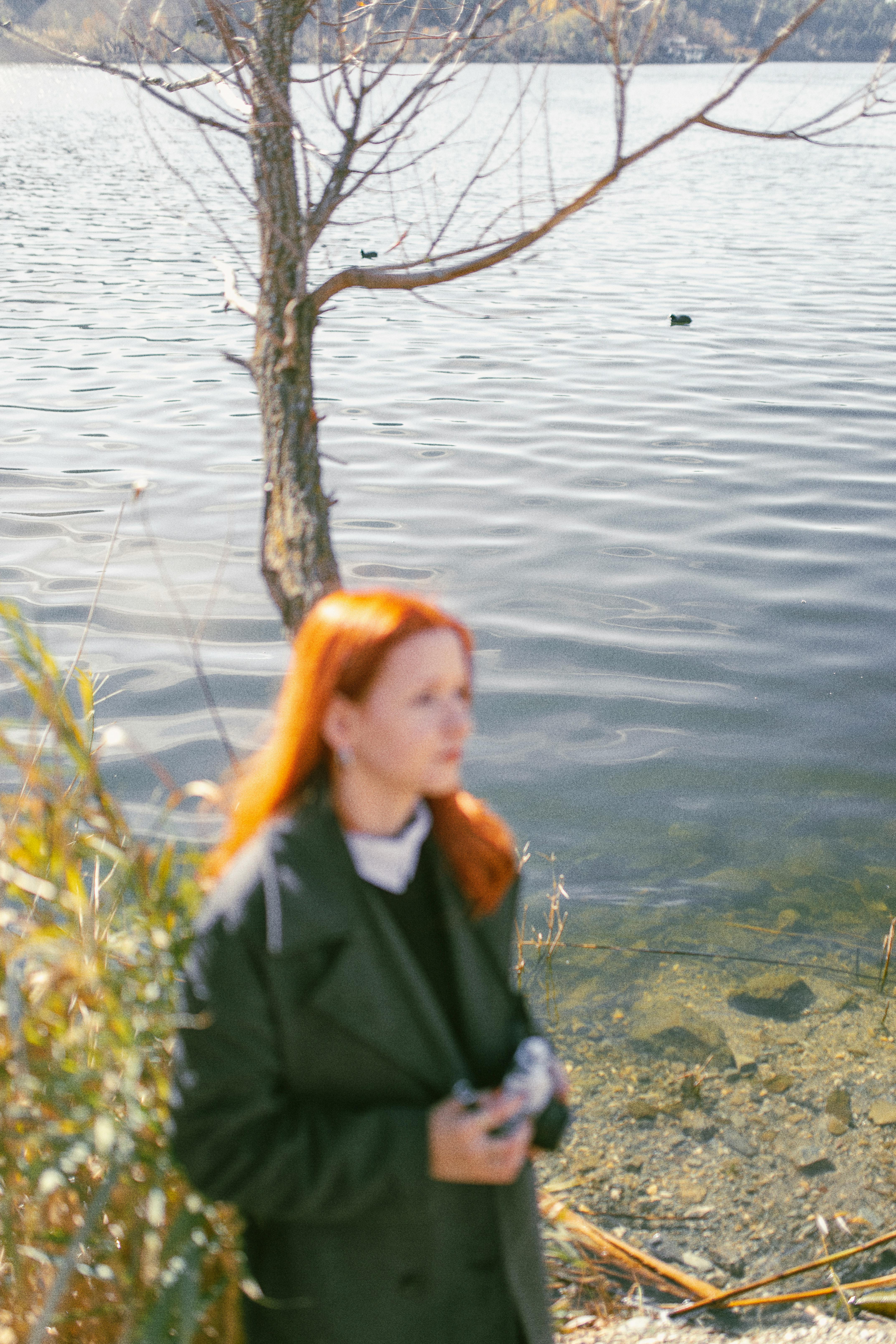 Redhead Woman by River · Free Stock Photo