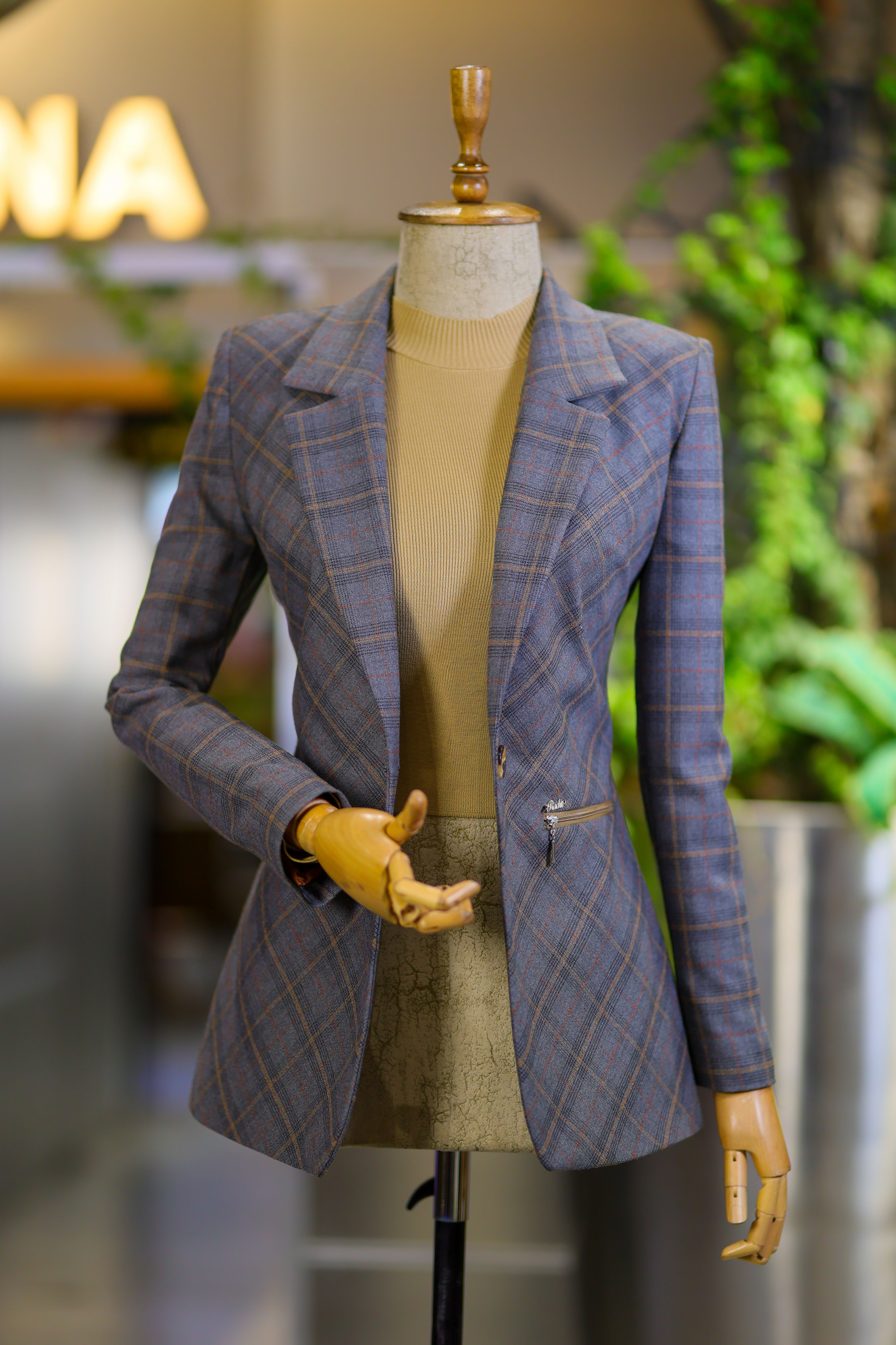 A Checkered Blazer Jacket on a Mannequin · Free Stock Photo