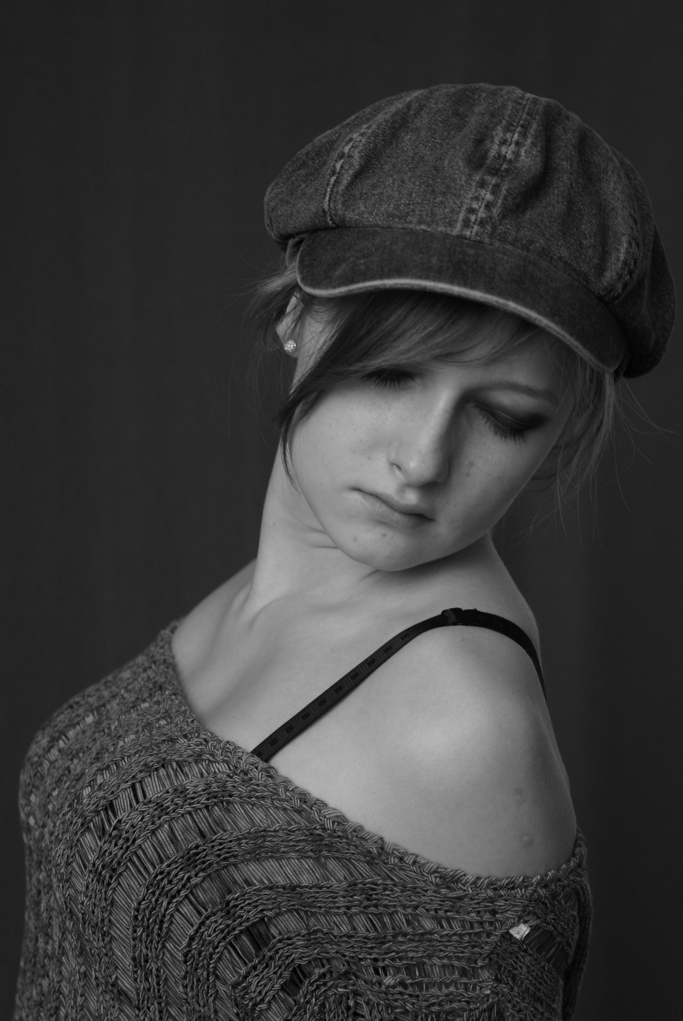 Back View of a Woman Black Sweater and Black Cap · Free Stock Photo