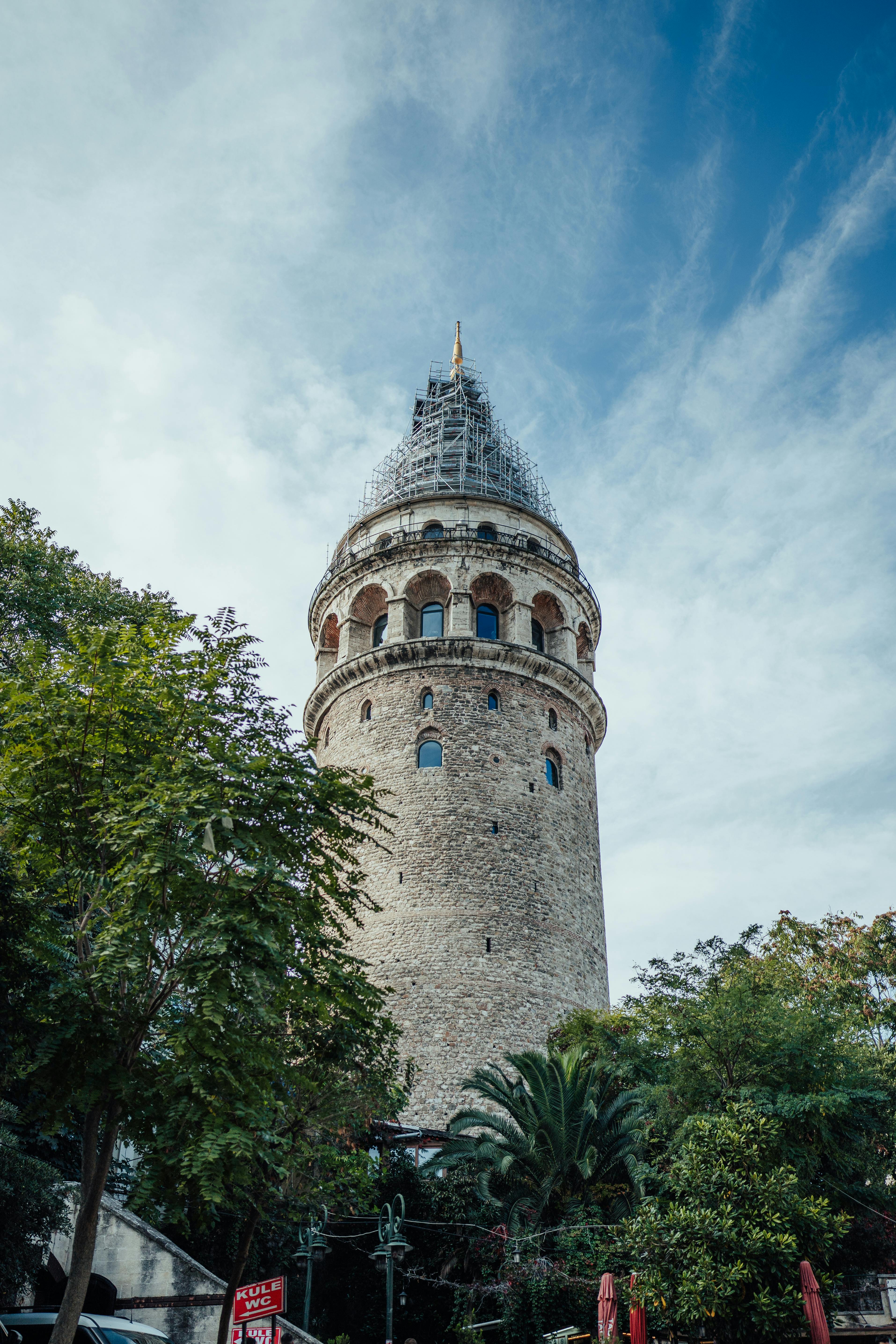 Monumental Tower between Trees · Free Stock Photo