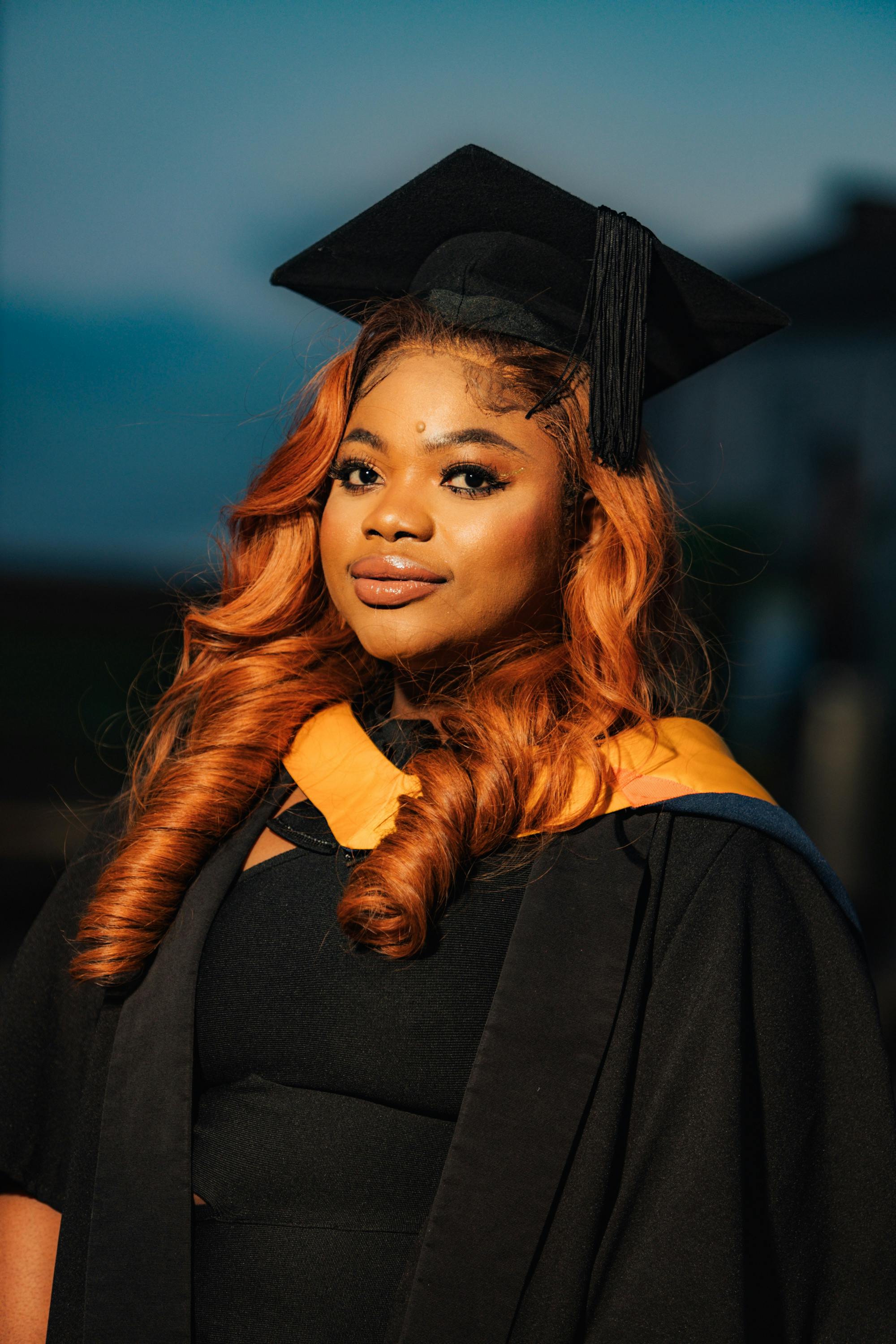 Portrait of a Female Graduate Wearing a Mortarboard · Free Stock Photo