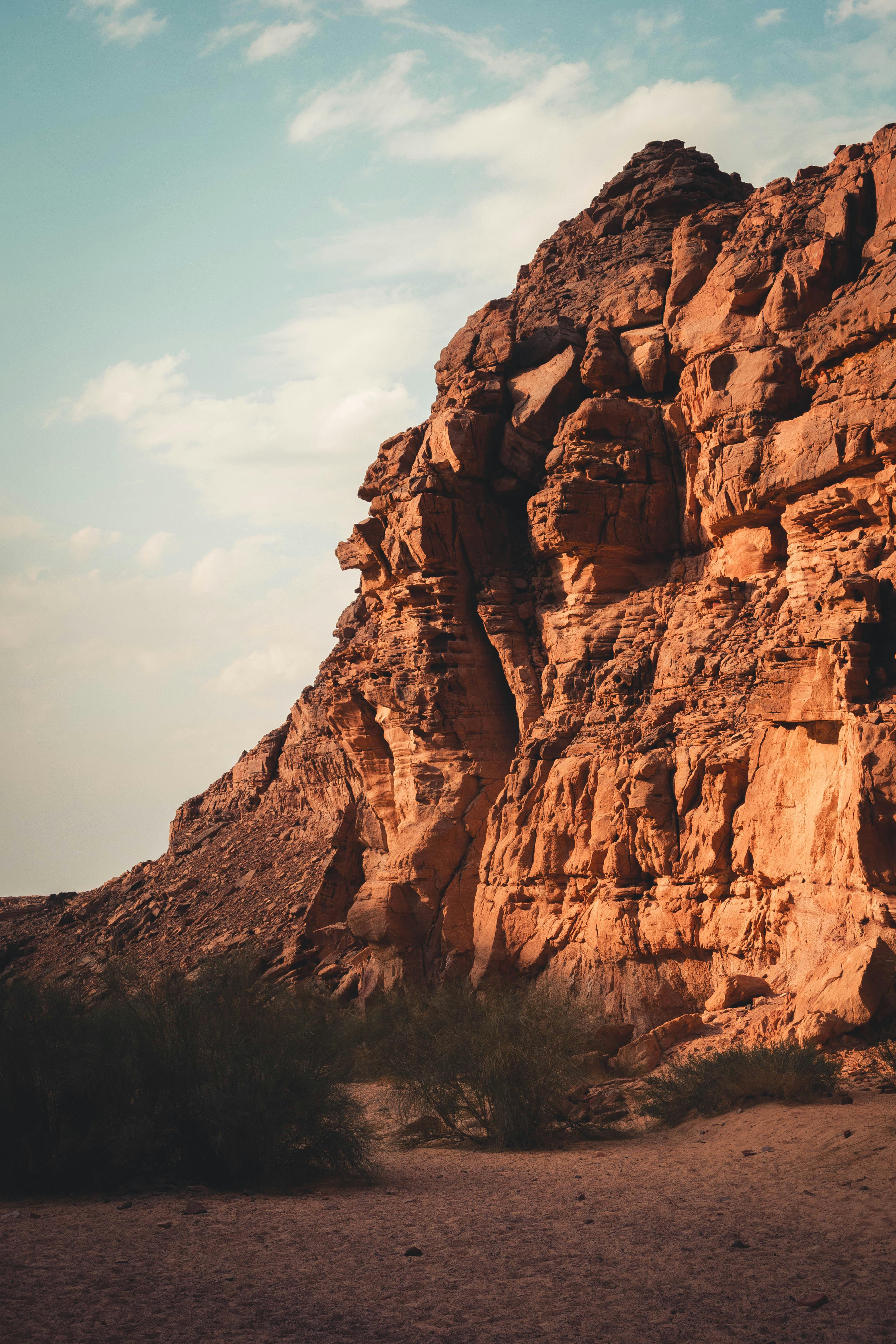 Brown Rocky Mountain Near River · Free Stock Photo