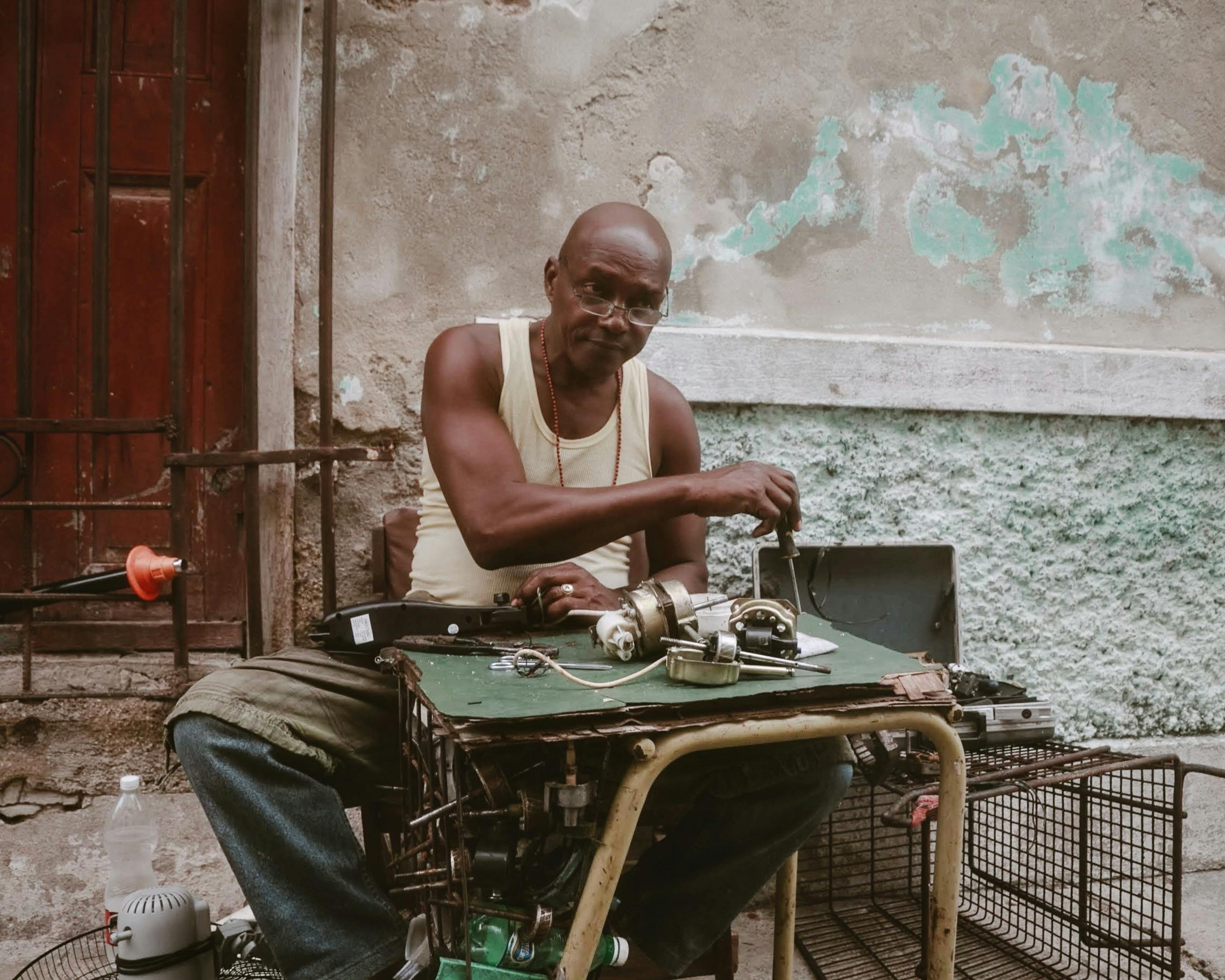 Person Holding a Rusty Engine Turbo · Free Stock Photo