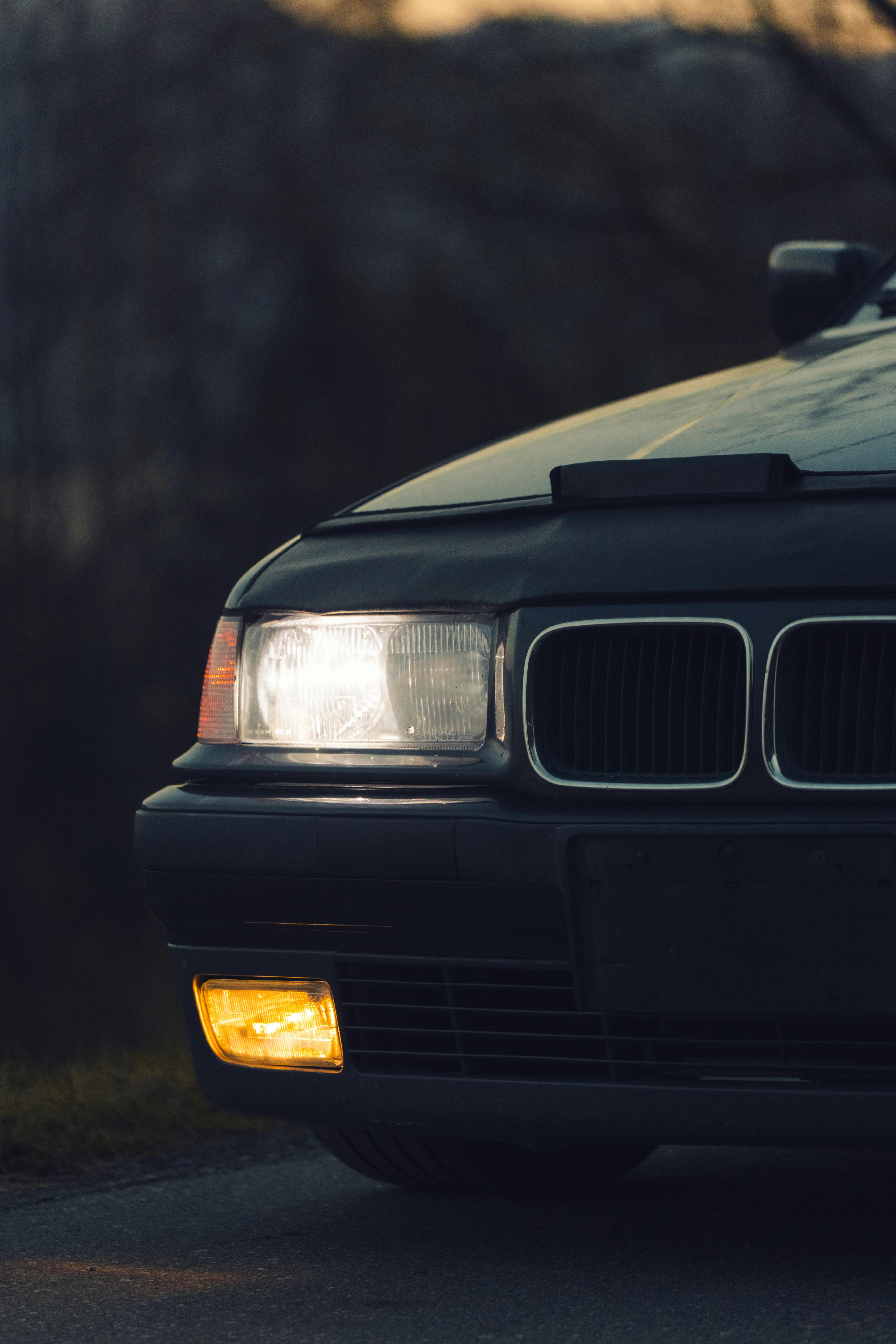 Lit Headlight and Fog Light of a BMW E36 Car · Free Stock Photo