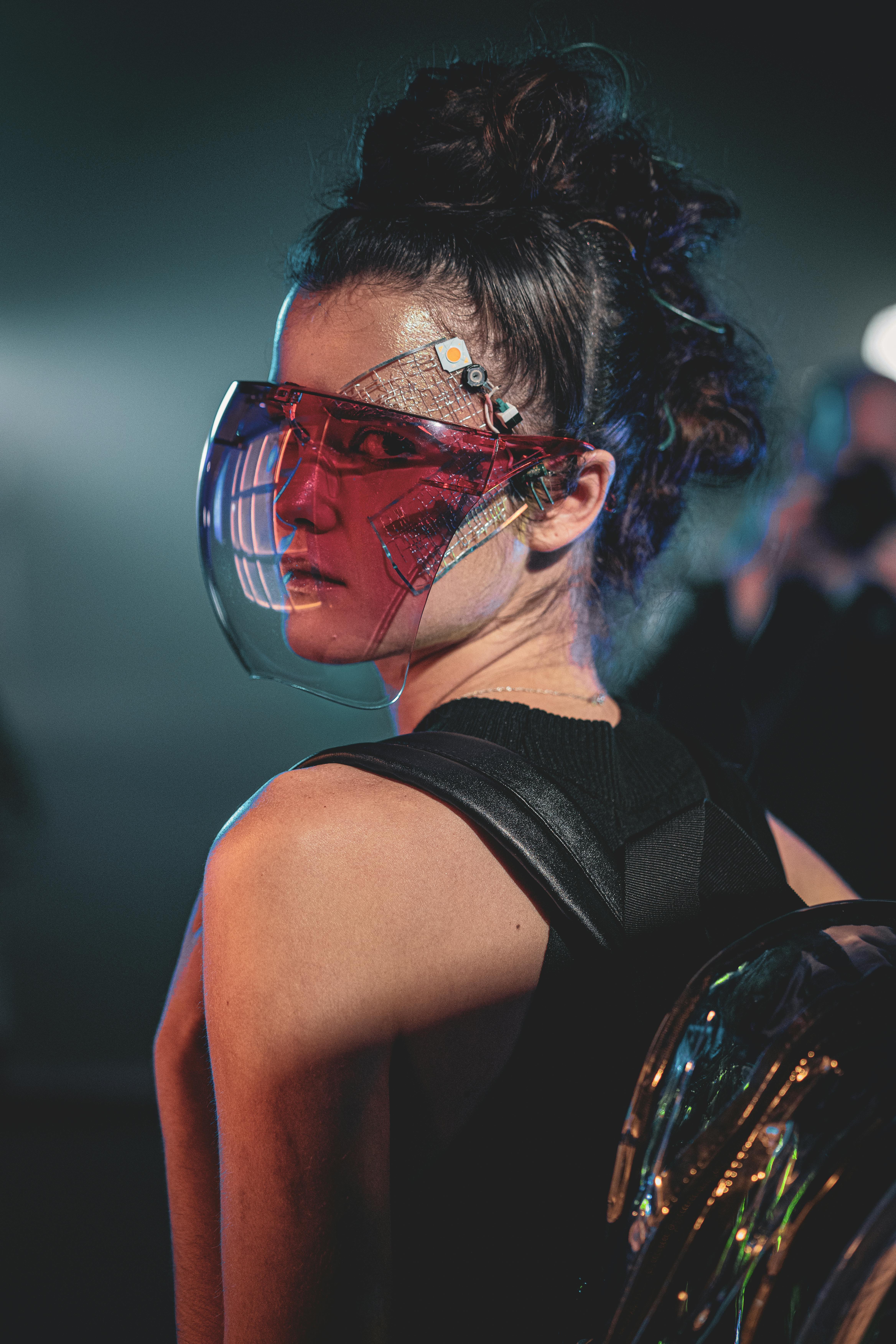 Model with a Futuristic Face Decoration and Purple Gradient Visor ...