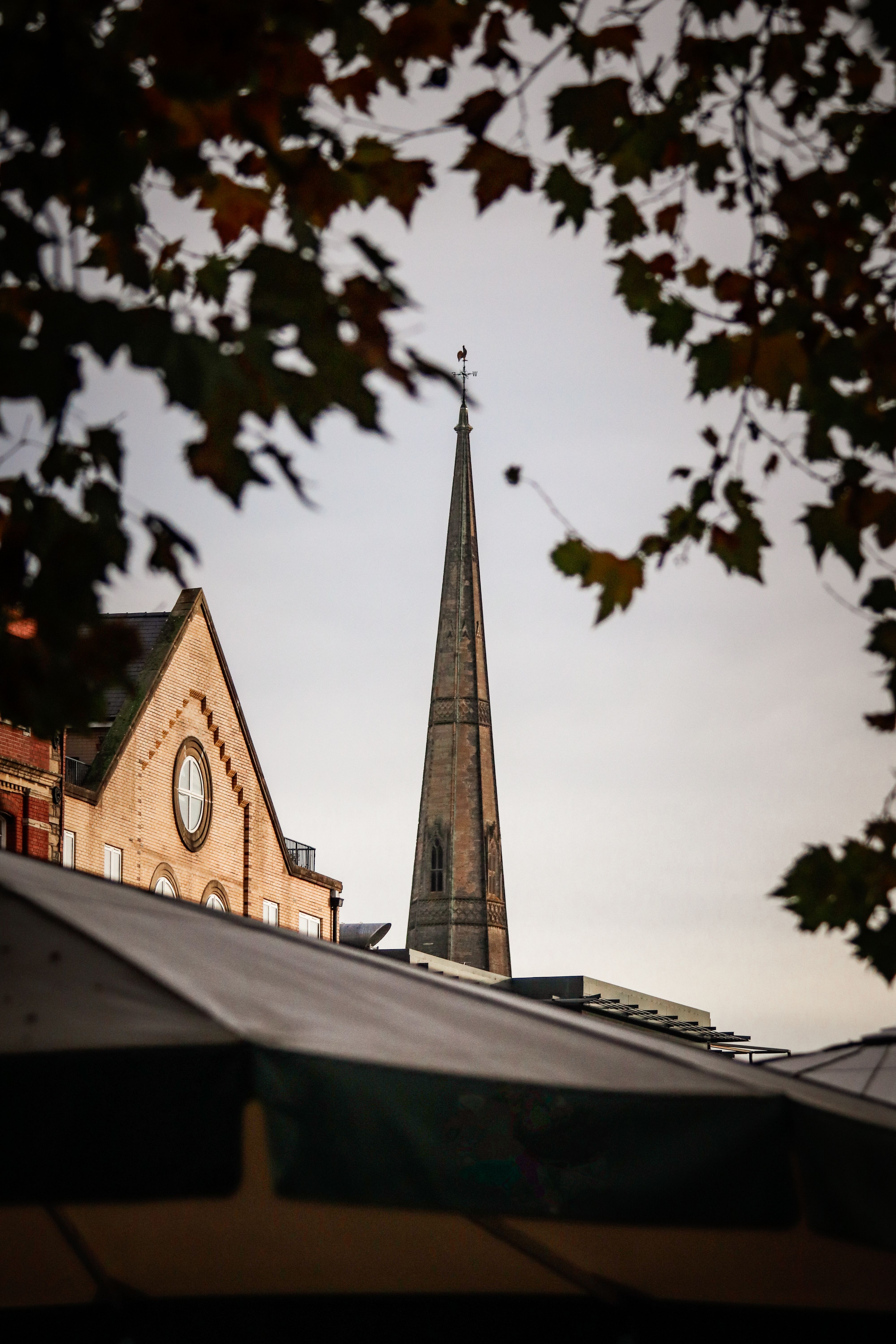 Spire of Church Towering over City · Free Stock Photo