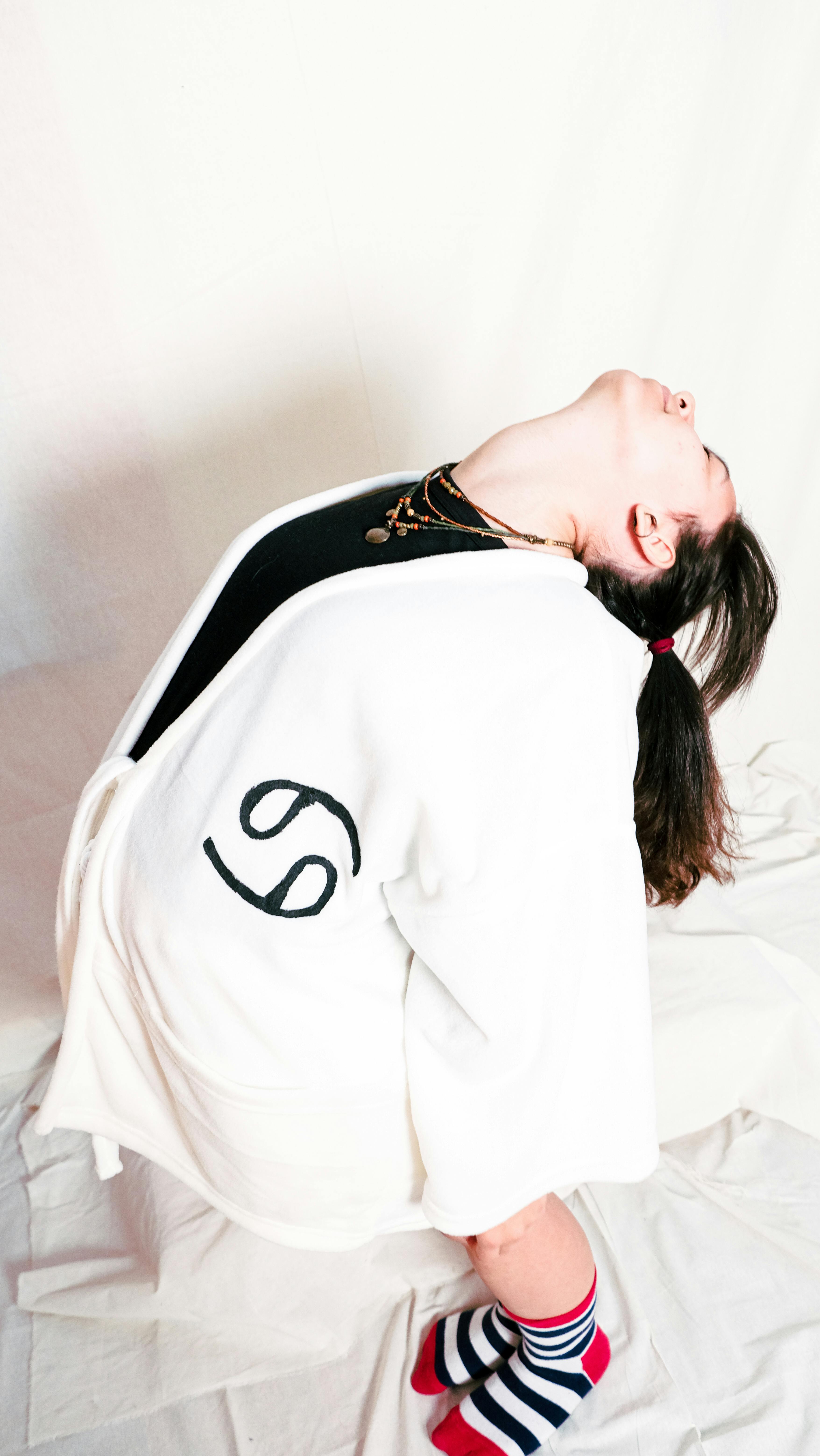 Brunette in Robe Stretching · Free Stock Photo