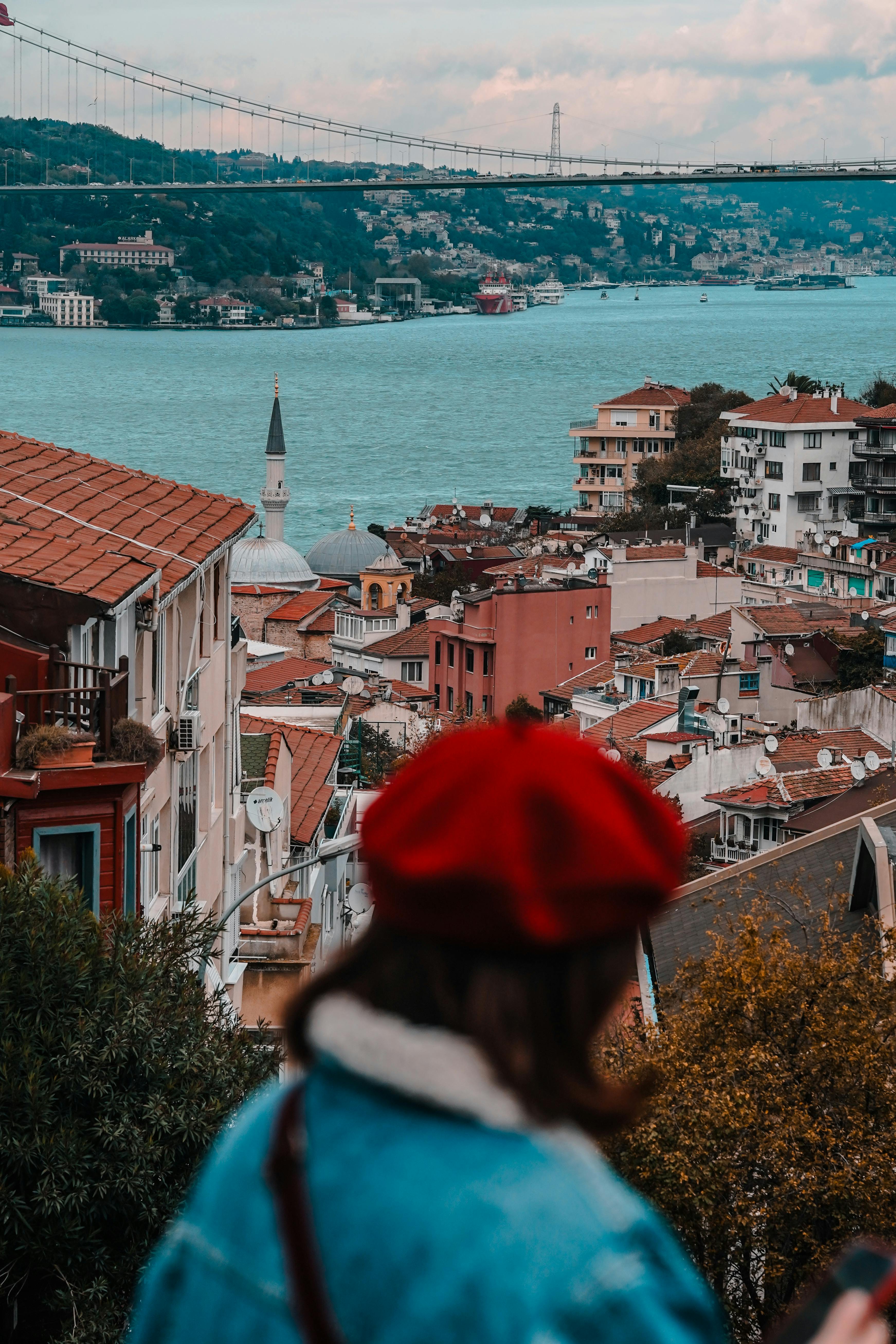 Bosphorus and Istanbul Buildings behind Woman in Beret · Free Stock Photo