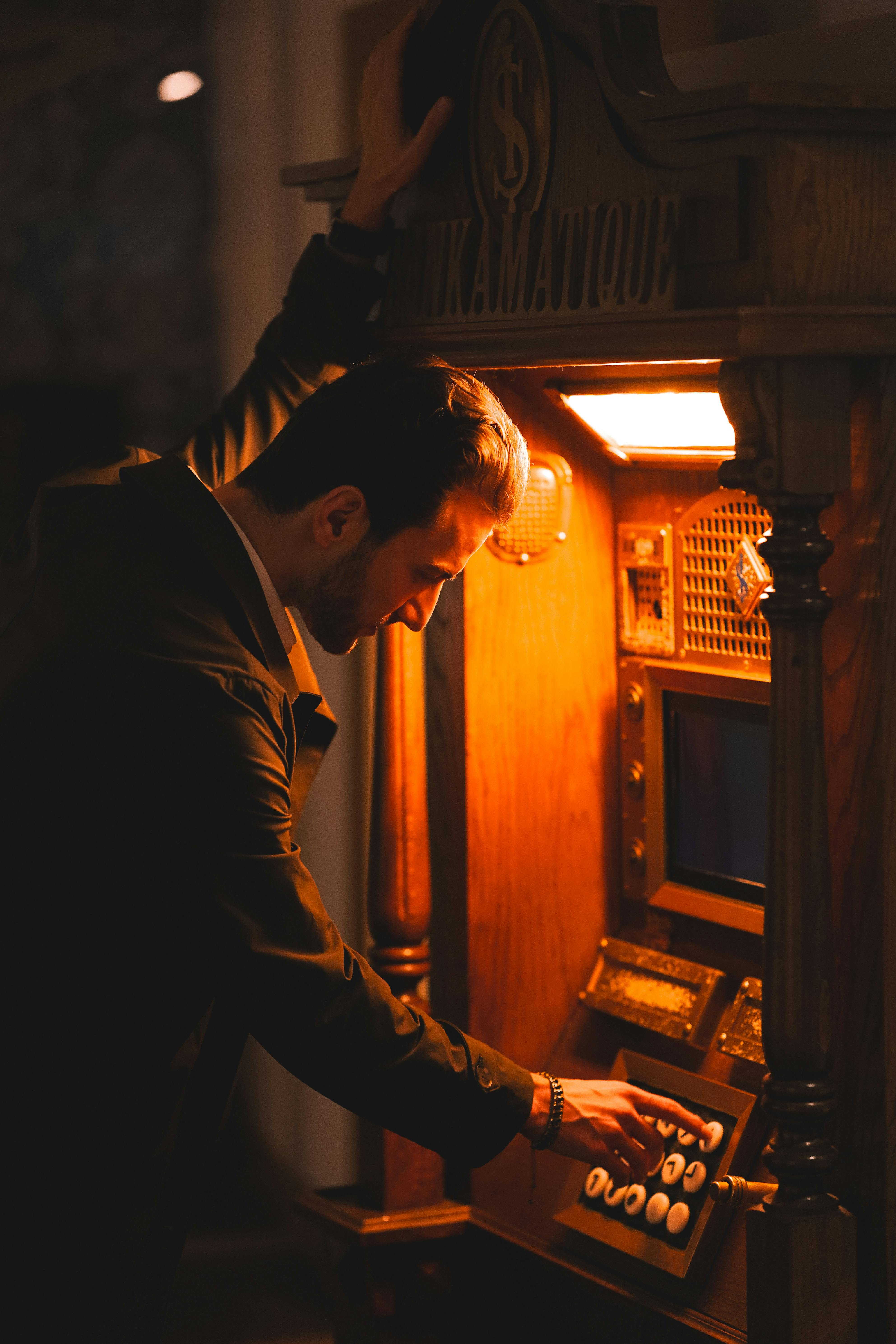 Man Using ATM at Night · Free Stock Photo