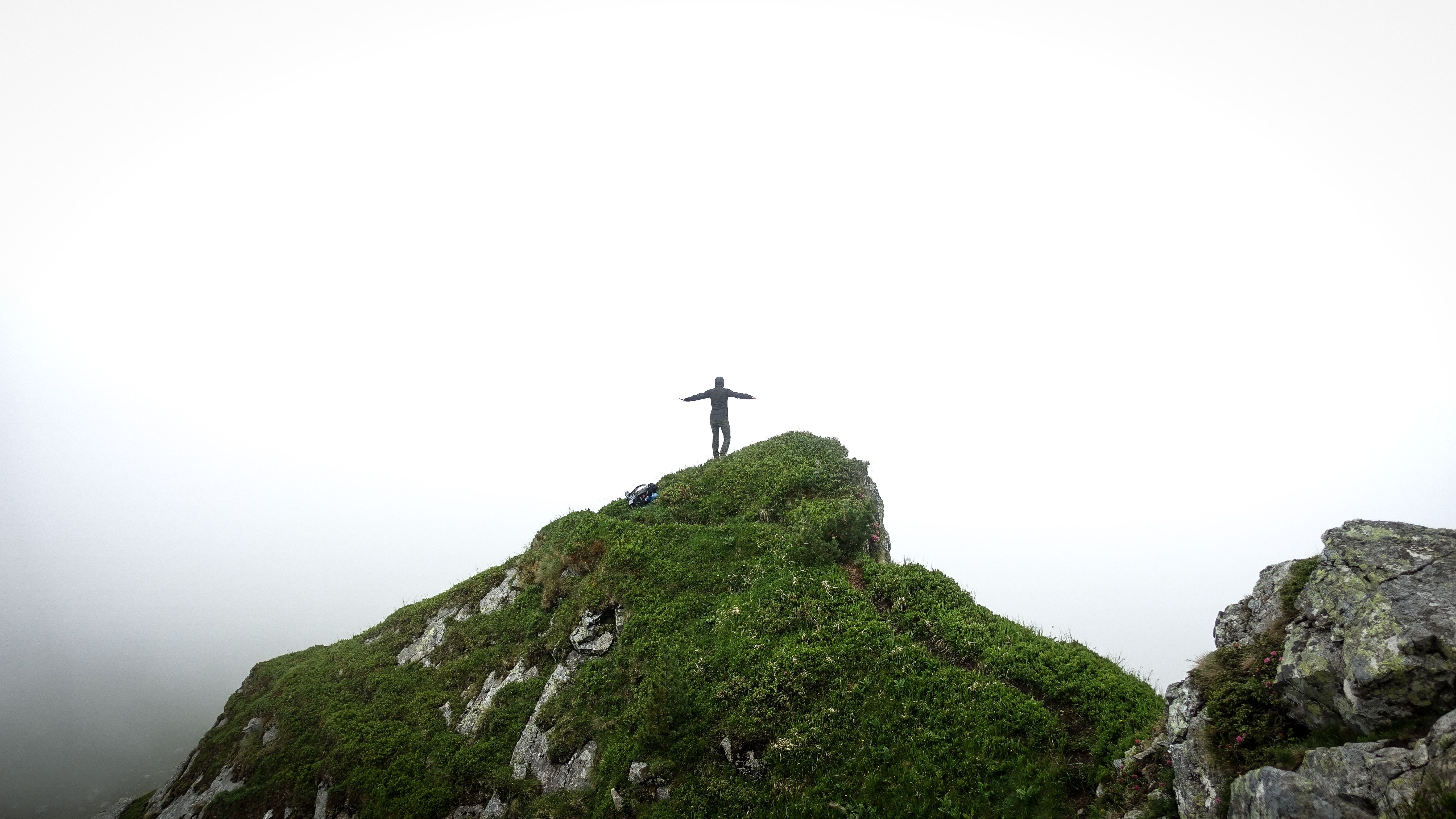 Man on a Hill in a Valley · Free Stock Photo
