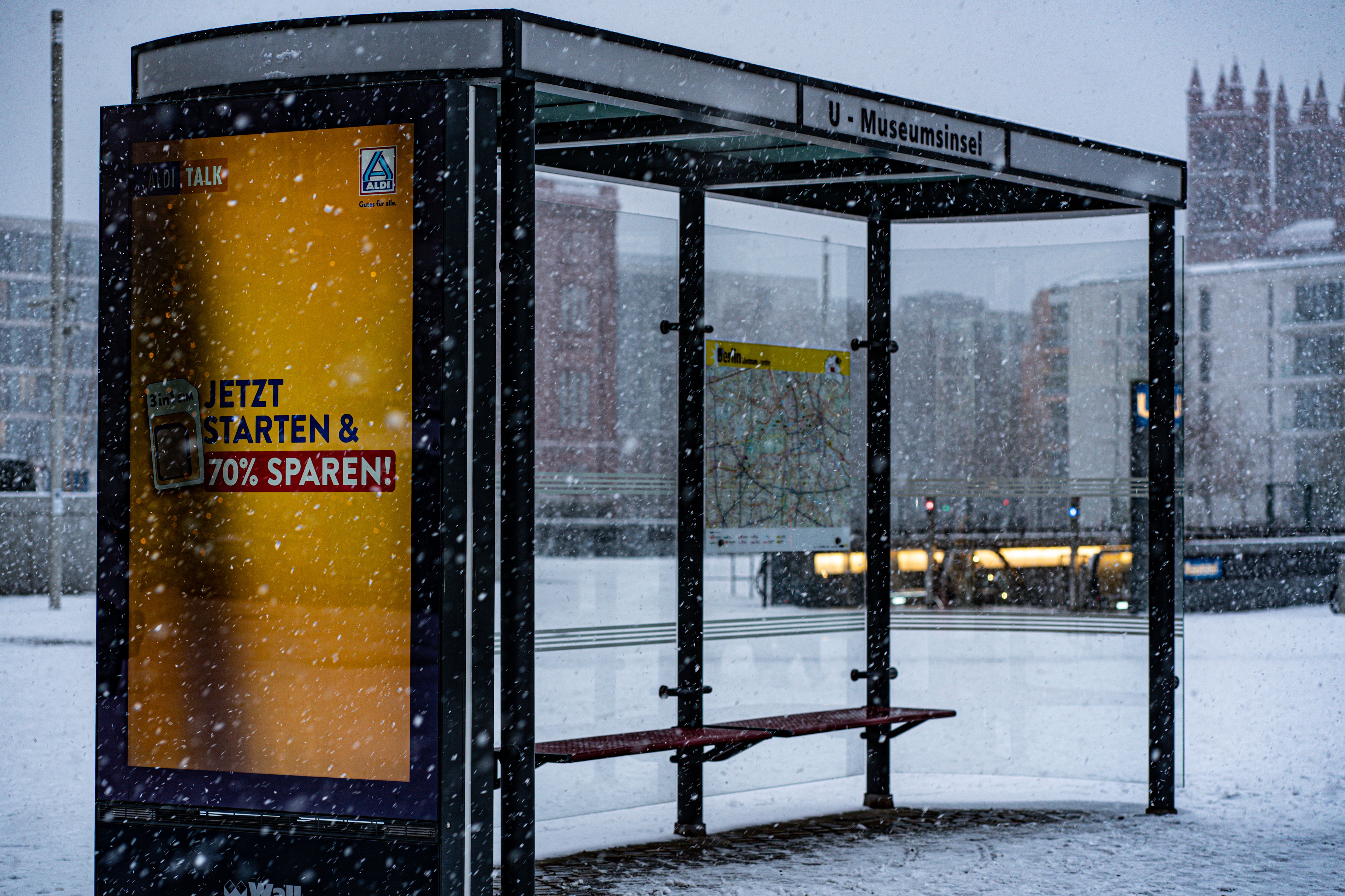 Empty Bus Stop on Snow Covered Street · Free Stock Photo