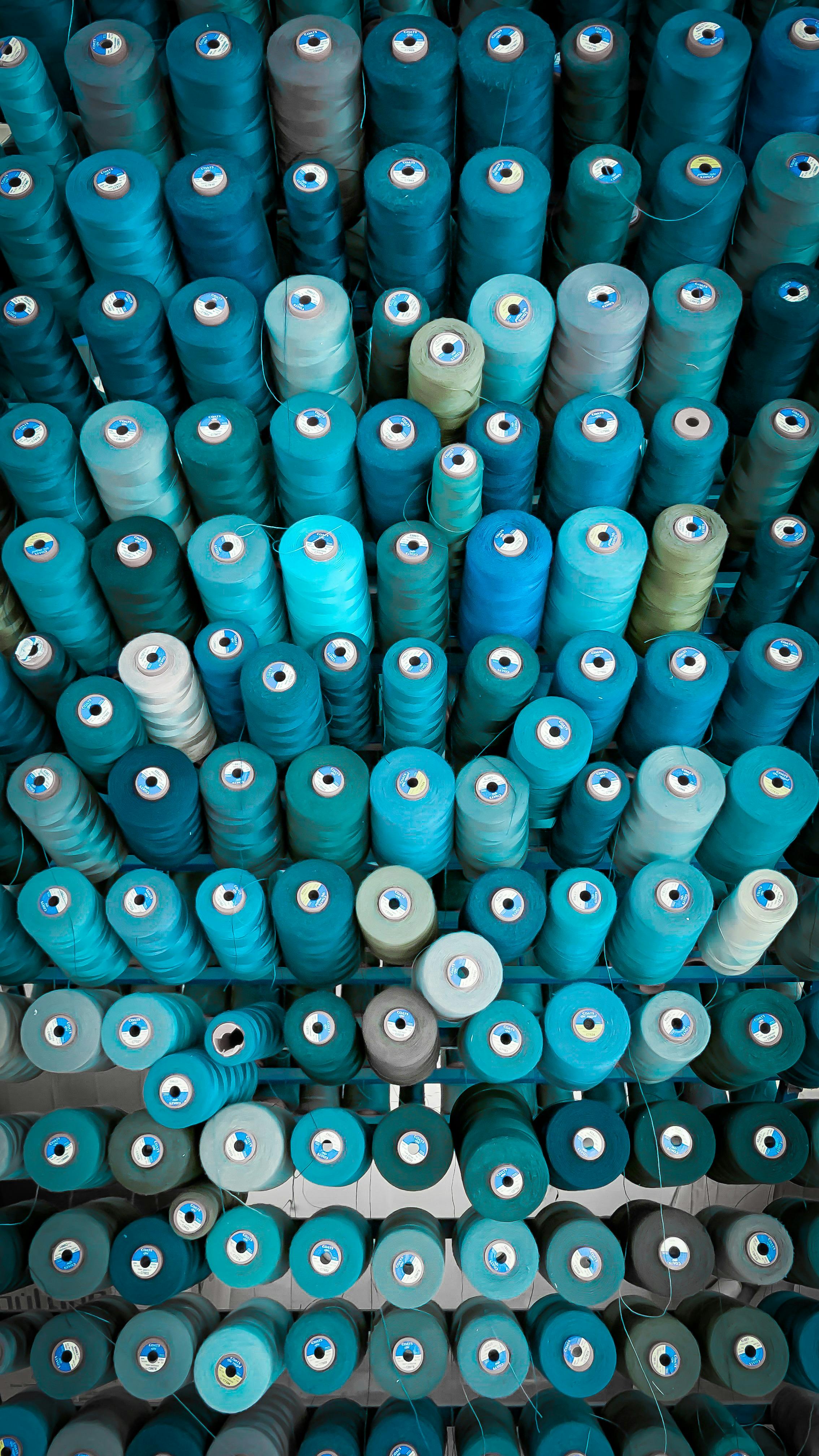 Spools of Blue Sowing Thread · Free Stock Photo