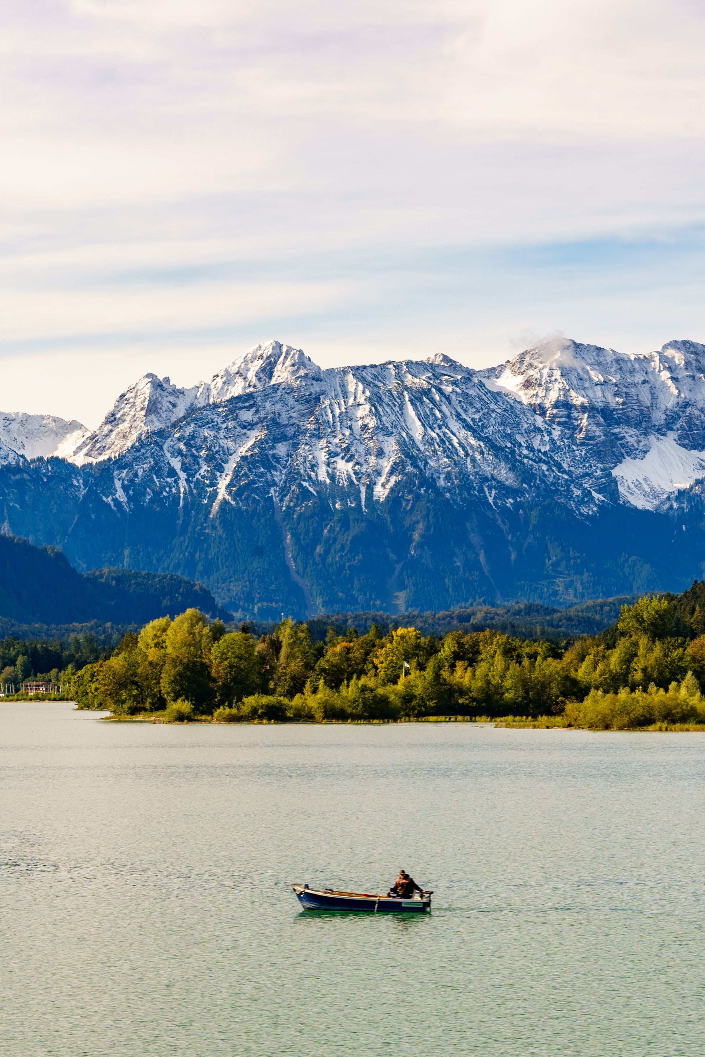 Men on Boat on Lake by Rocky Mountain · Free Stock Photo