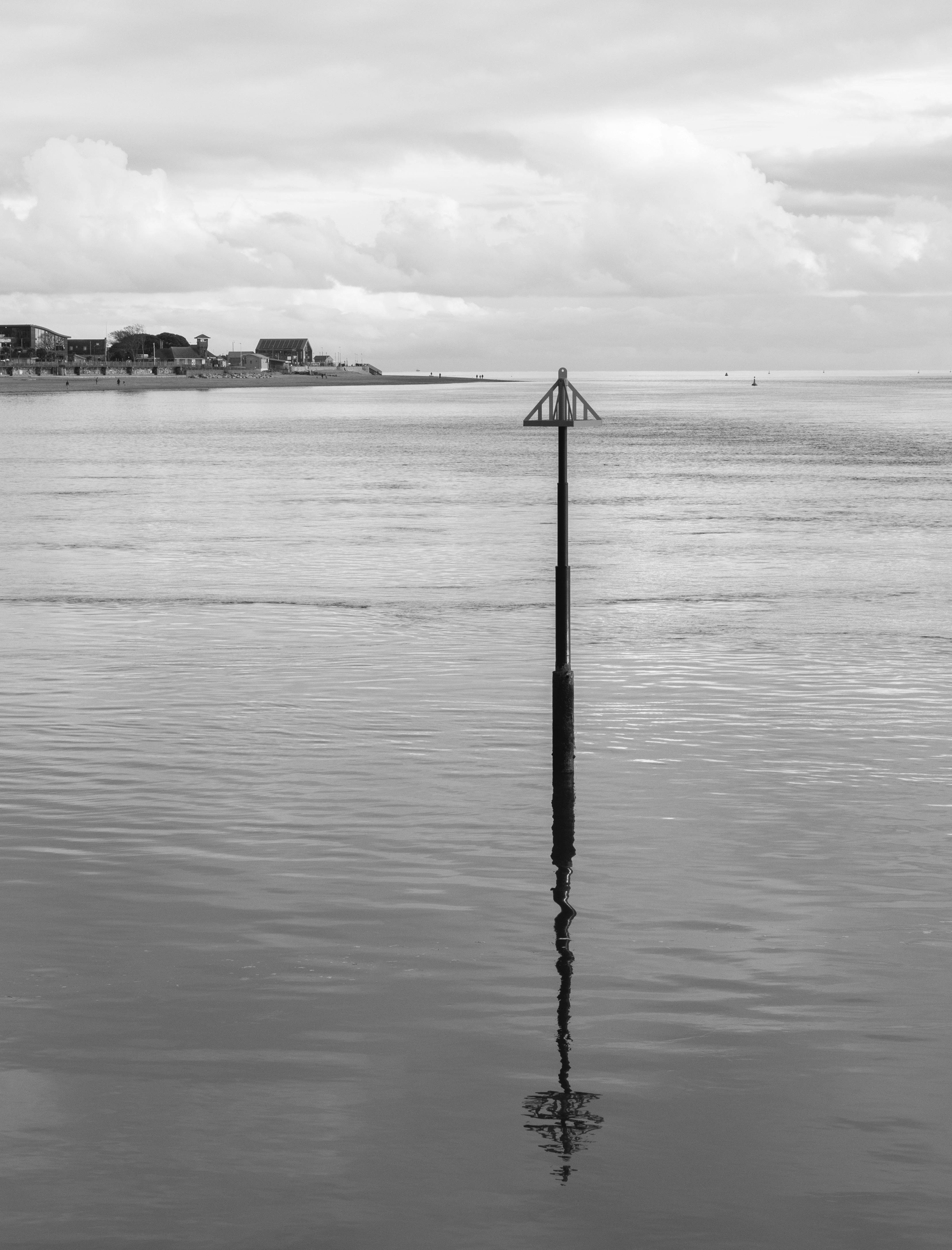 Reflection of a Buoy in a Sea in Black and White · Free Stock Photo