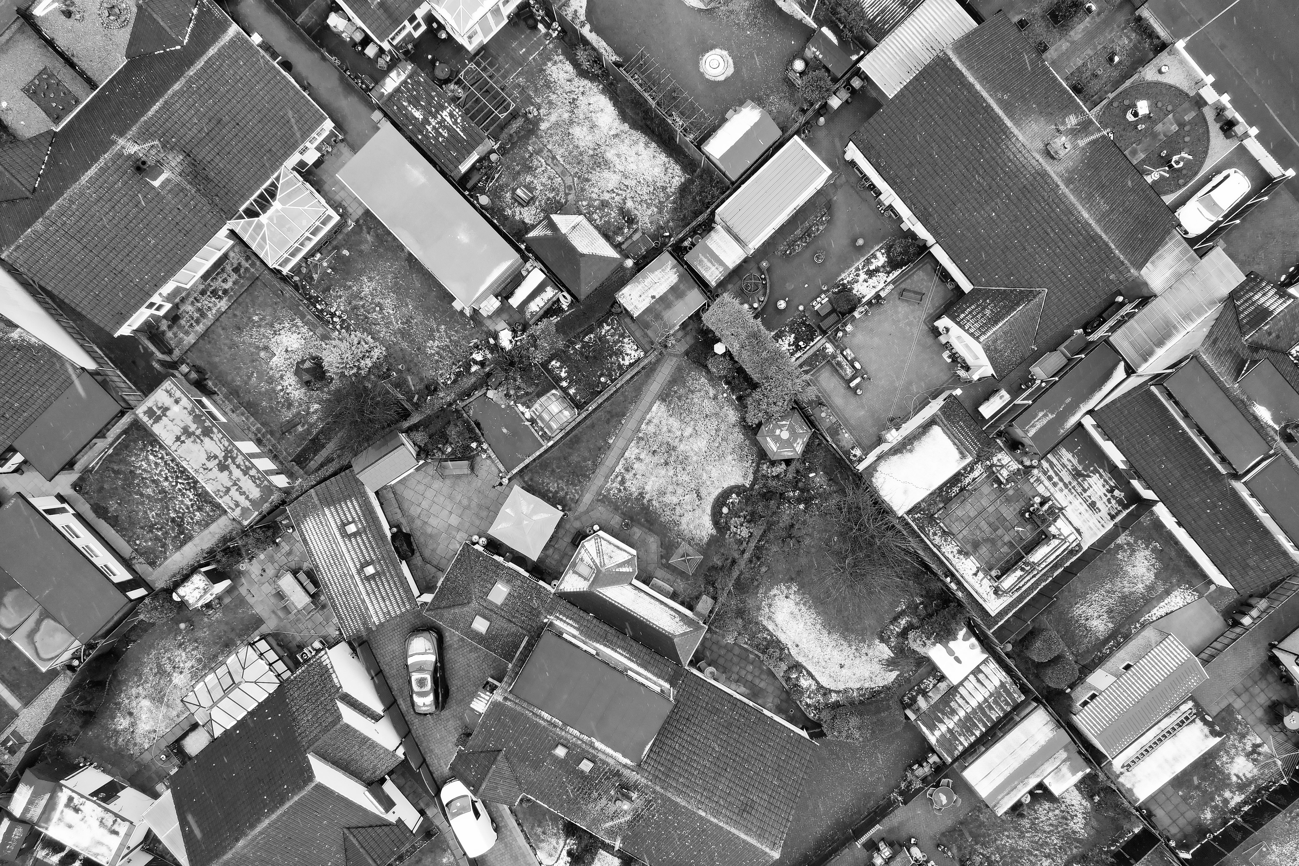 Aerial View of Snow Covered Yards and Rooftops of Tightly Packed Houses ...