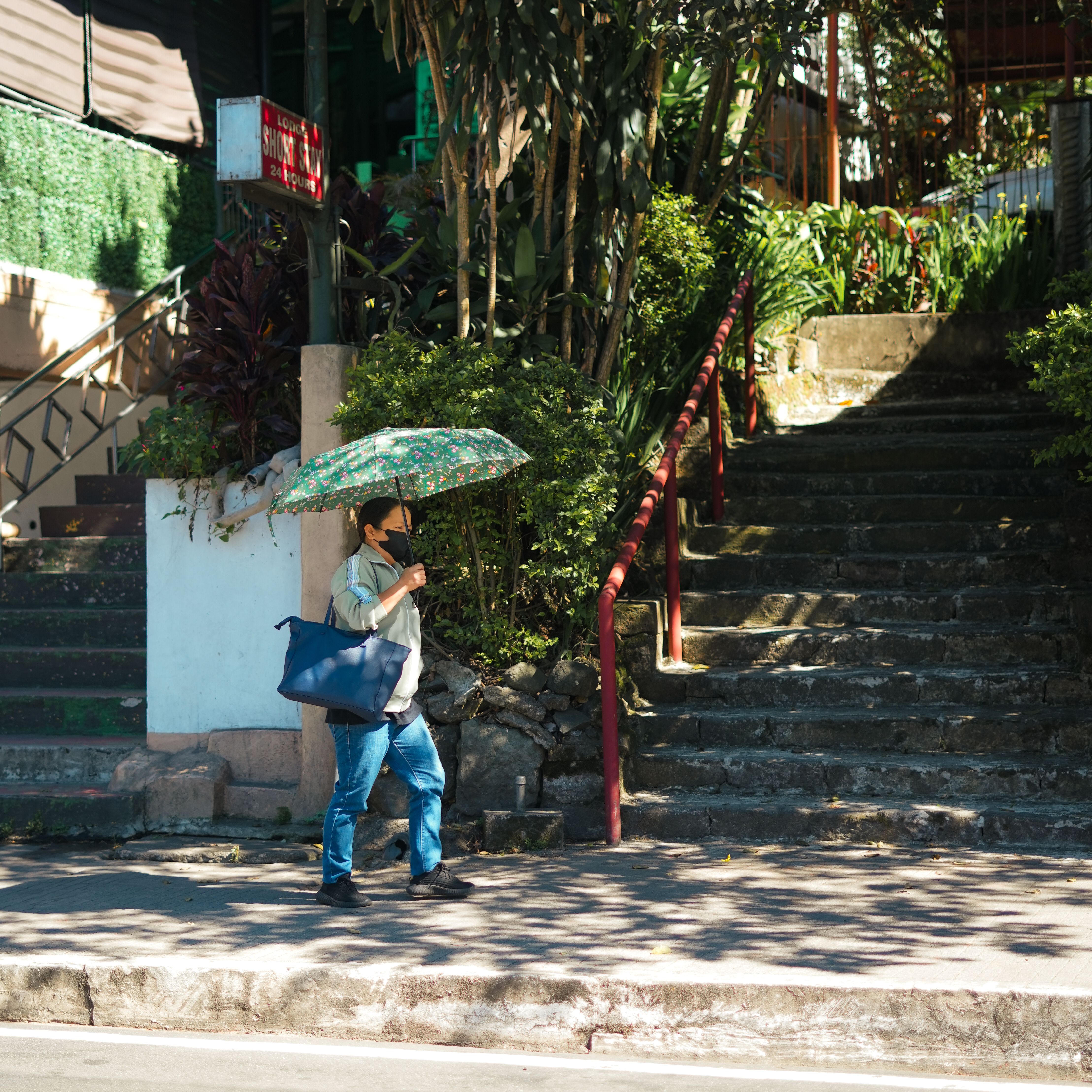 Woman in Face Mask under Umbrella on Sunny Day · Free Stock Photo