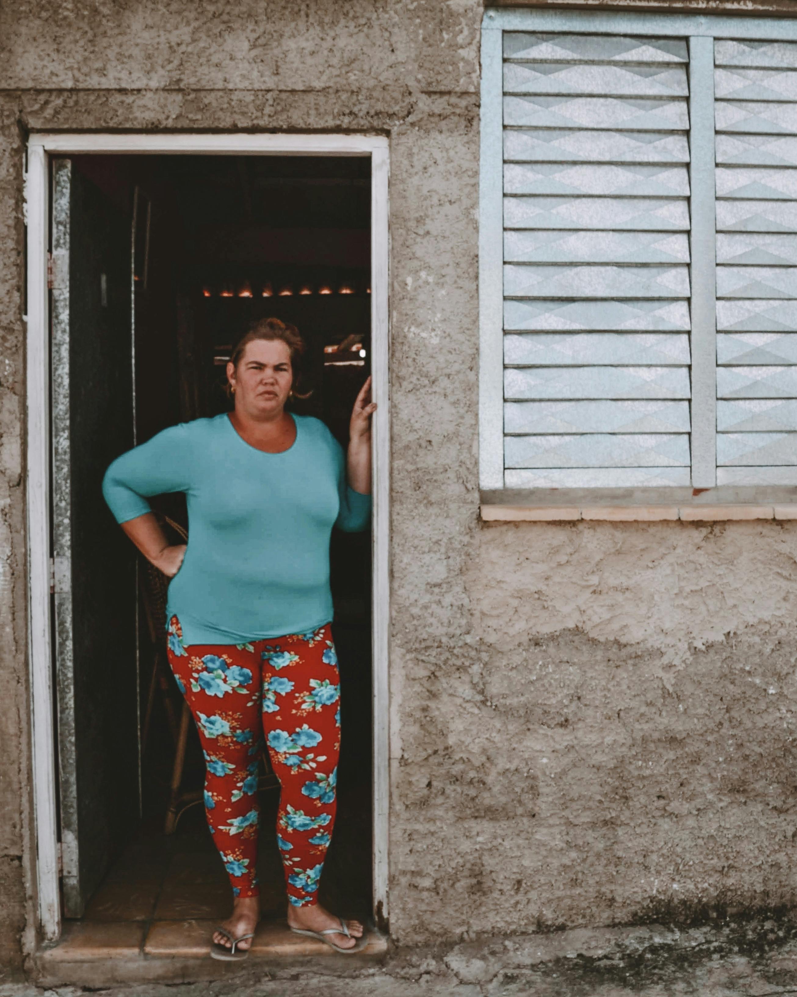Woman in the Doorway of the House · Free Stock Photo