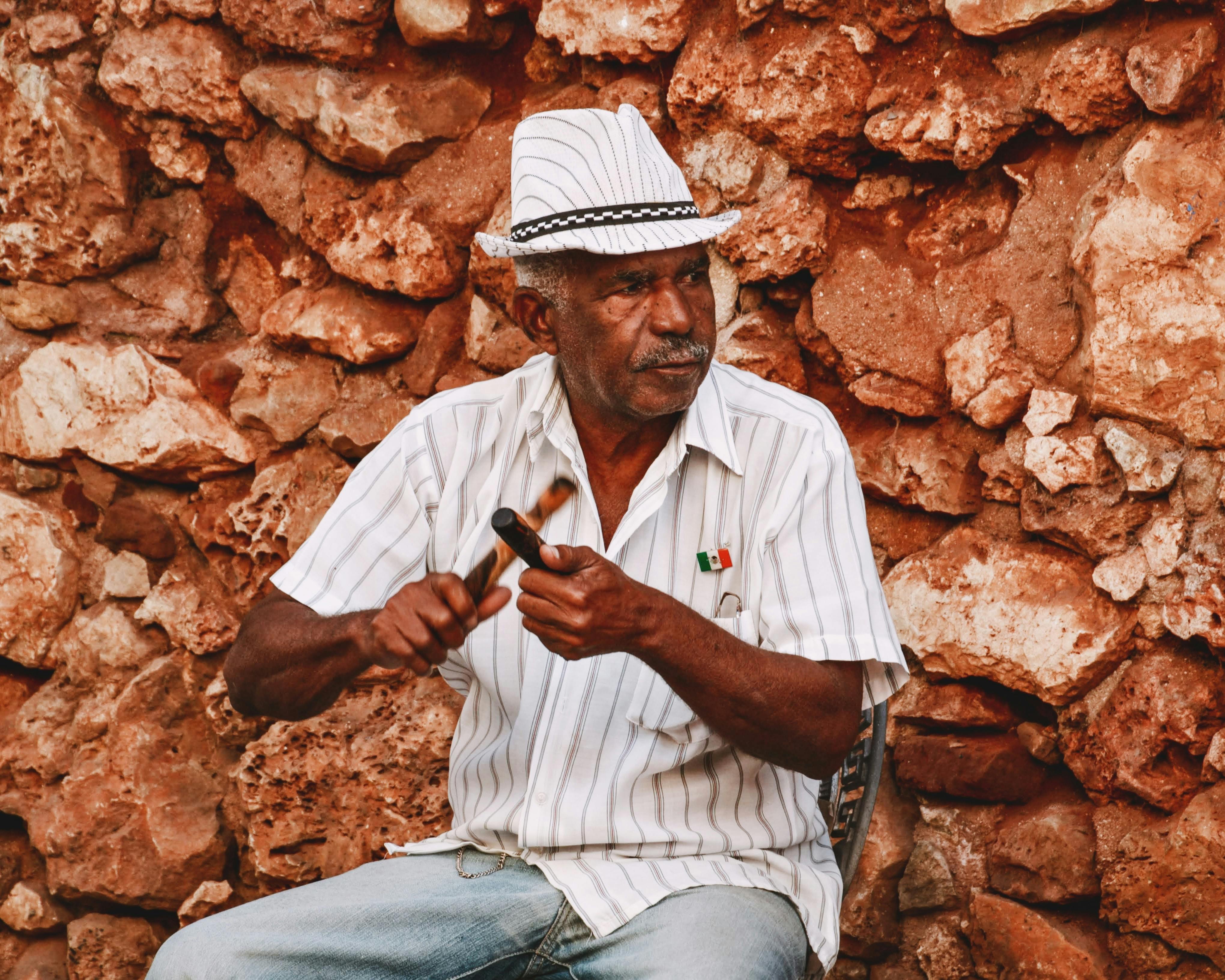 Elderly Man with a Pin in the Colors of the Mexican Flag Tapping the ...