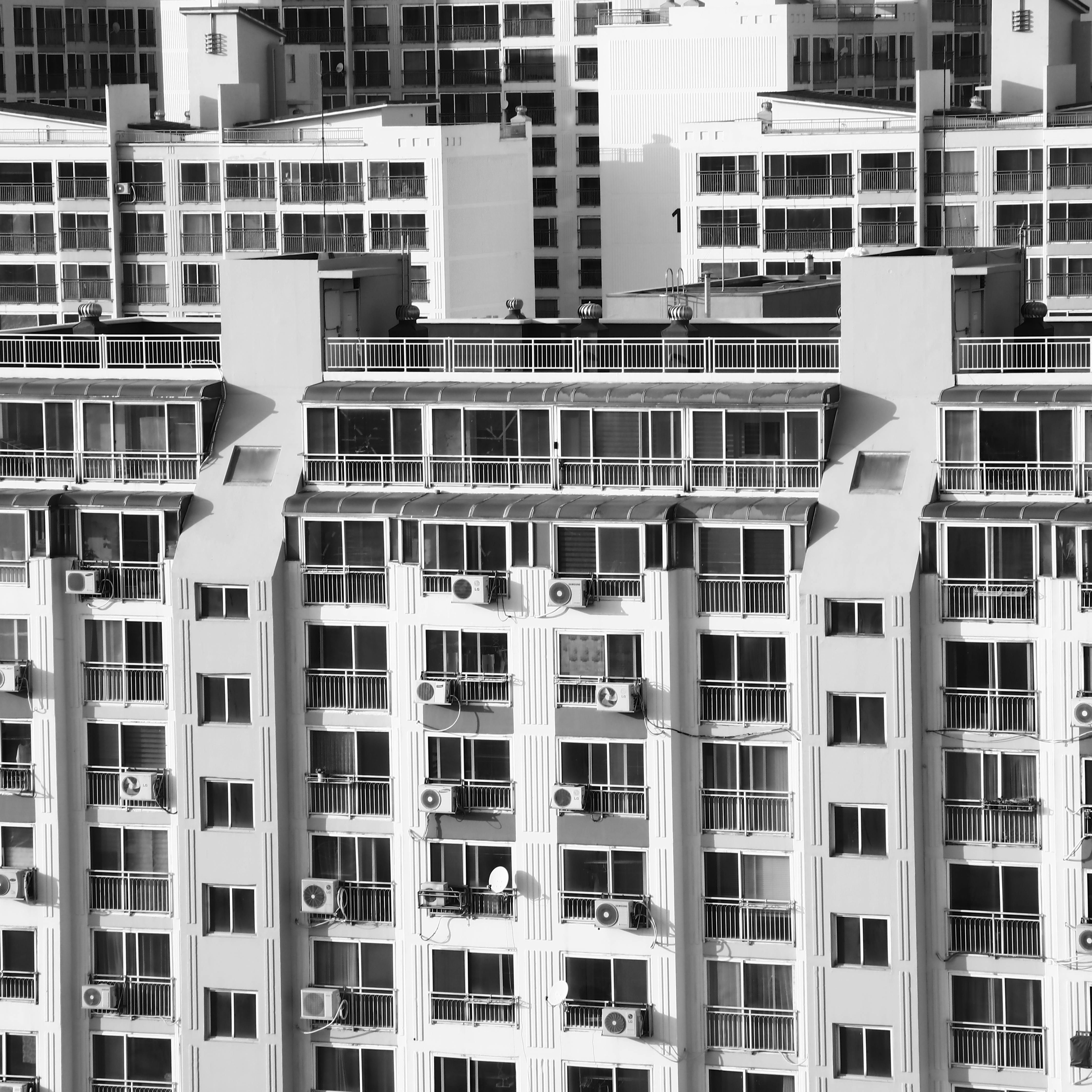 Apartment Blocks with Air Conditioners by the Windows · Free Stock Photo